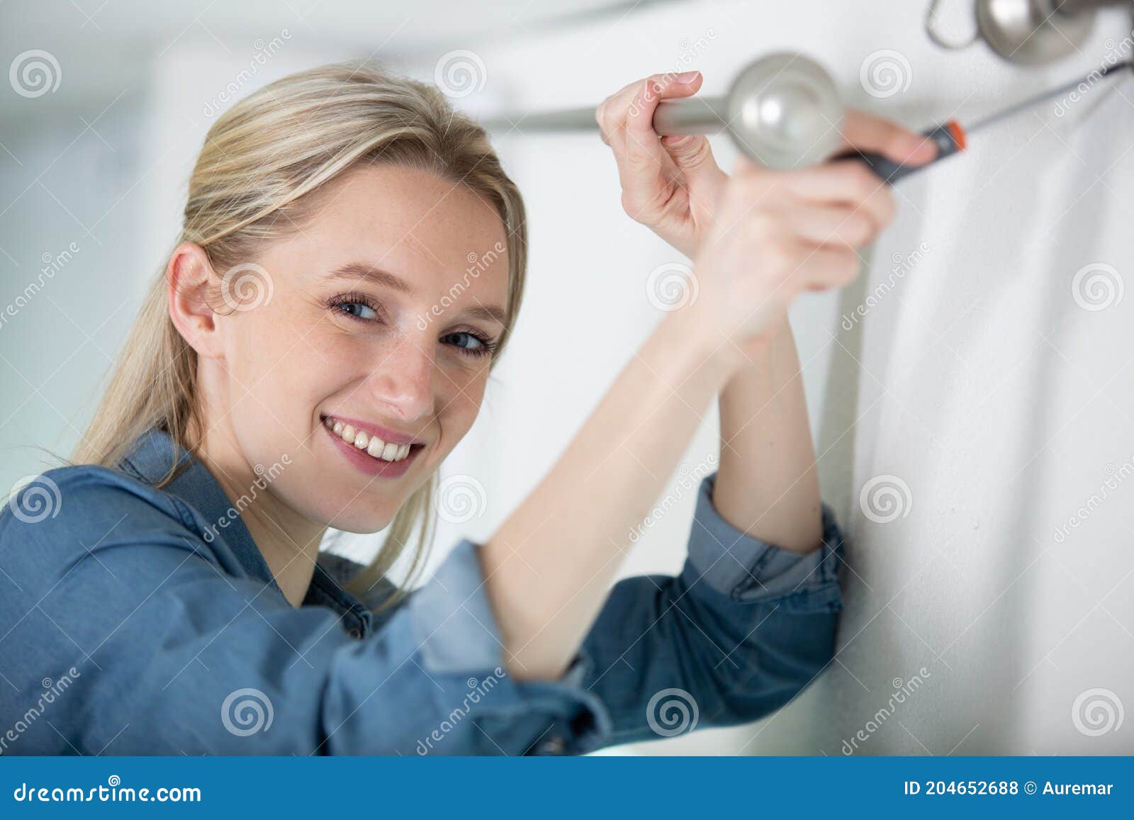 Young Woman Changing Light Bulb Stock Photo - Image of room, renovation ...