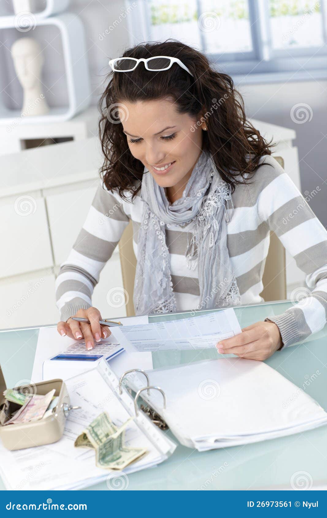 Young woman checking bills stock image. Image of happiness - 26973561
