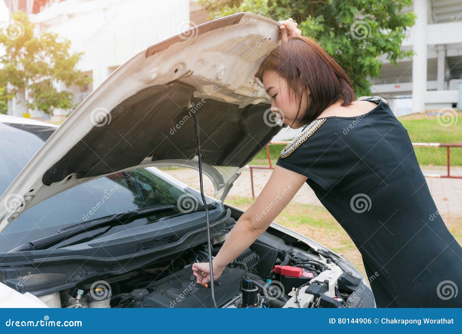 Young Woman Checking with Repairing Her Broken Car. Stock Photo - Image ...