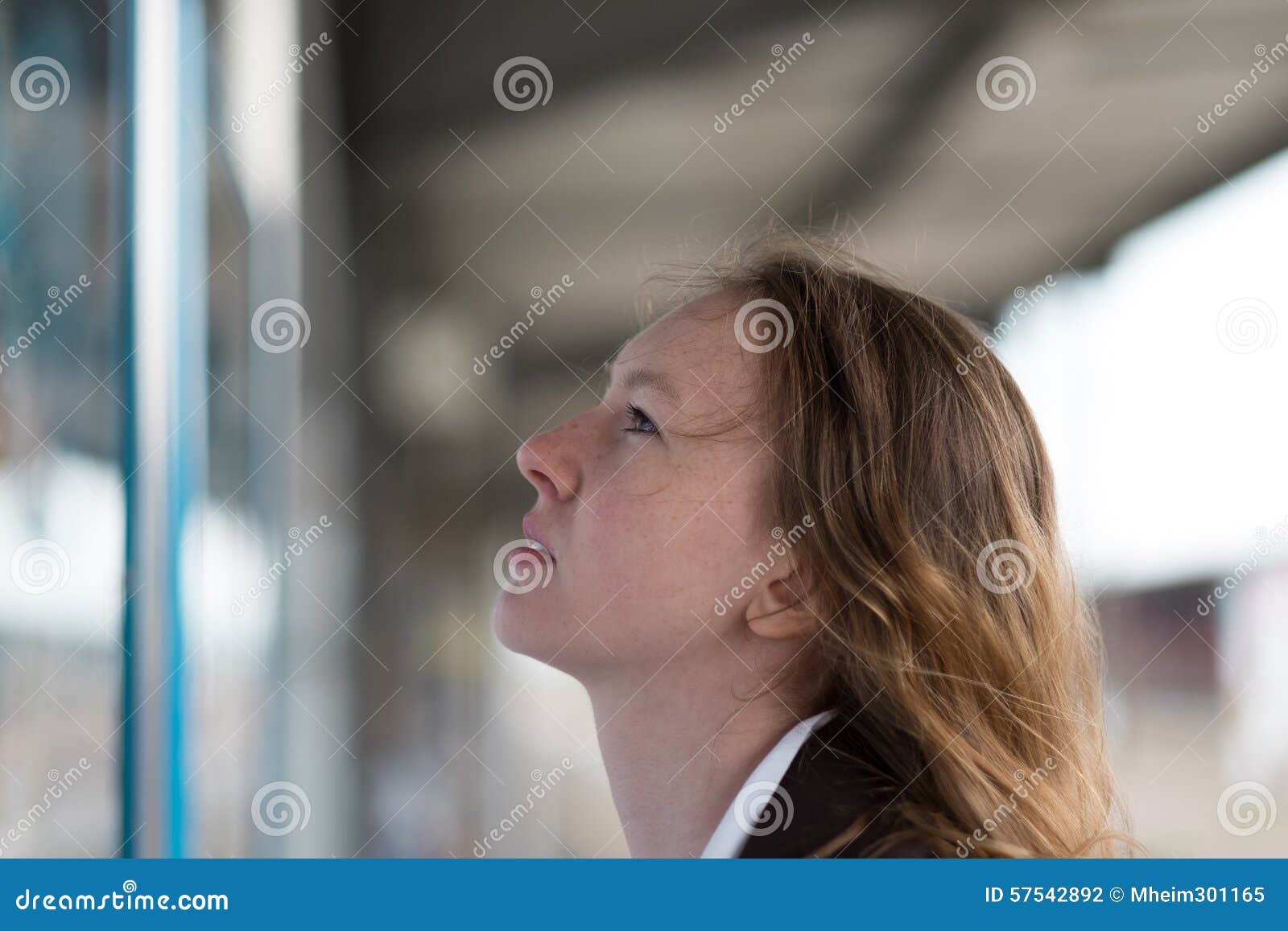 Young Woman Checking a Timetable Stock Photo - Image of board, serious ...