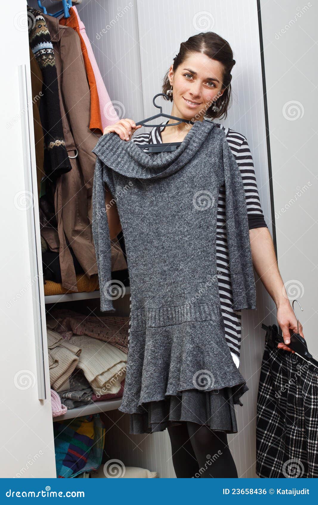 Young Woman Choosing Clothes Stock Photo - Image of fresh, clothe: 23658436