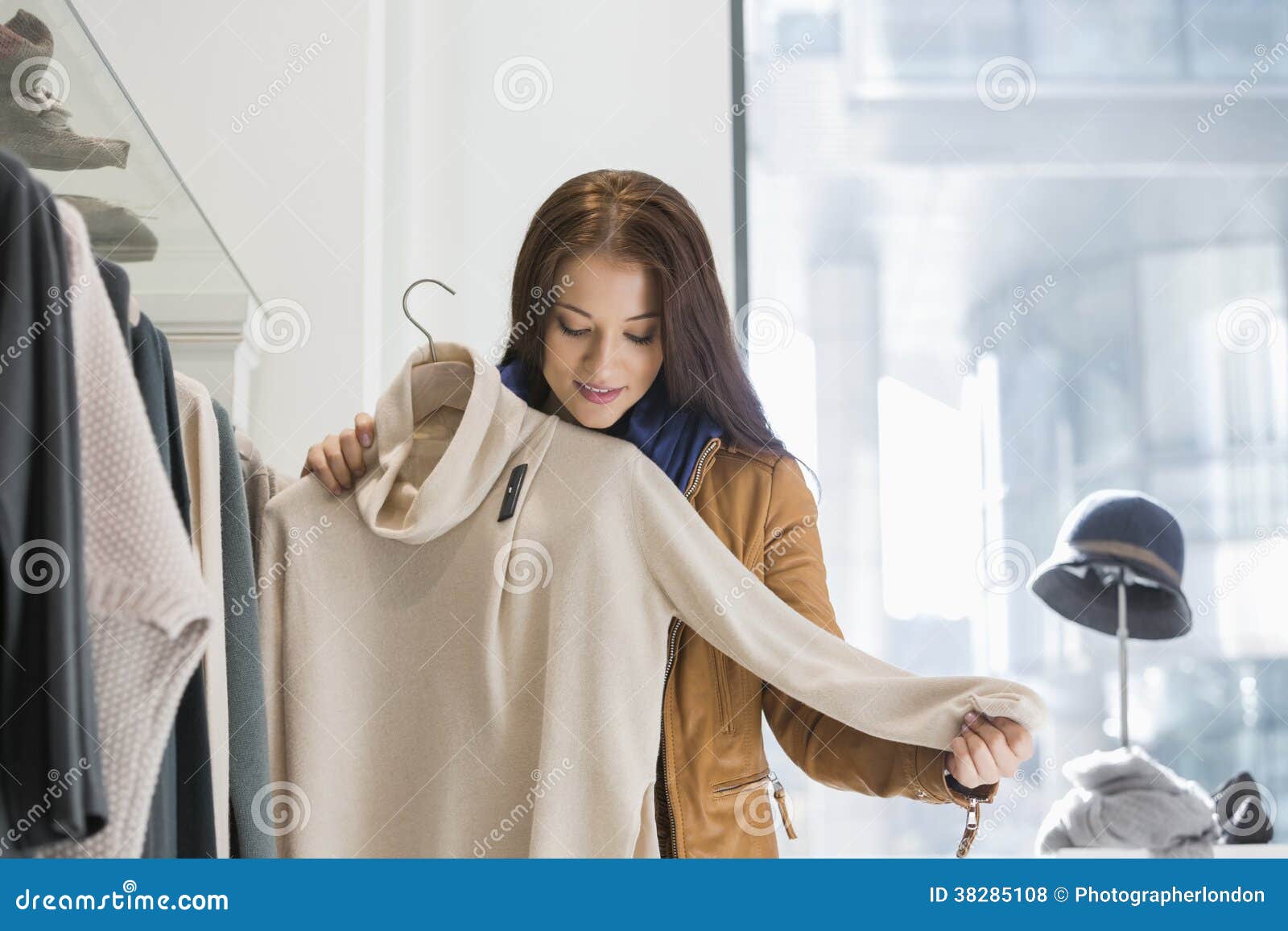 Young Woman Choosing Sweater in Store Stock Photo - Image of female ...