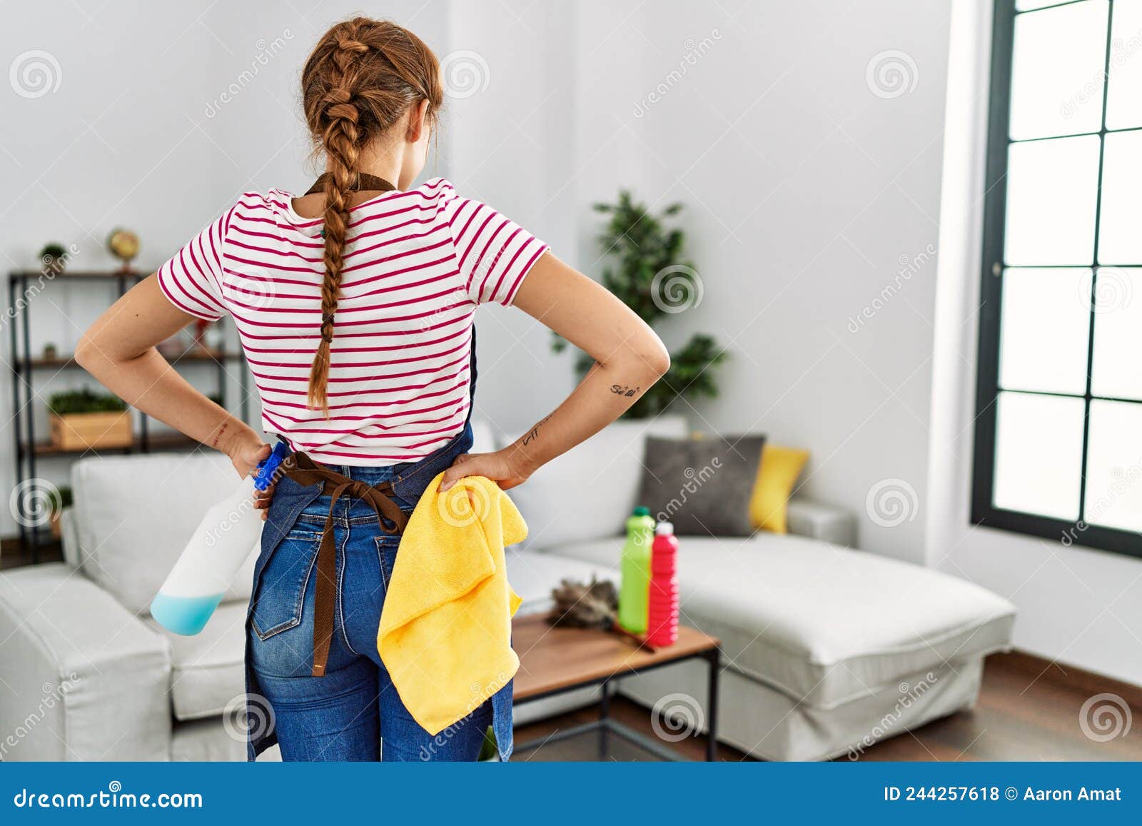 Young Woman Cleaner on Back View Standing at Home Stock Photo - Image ...