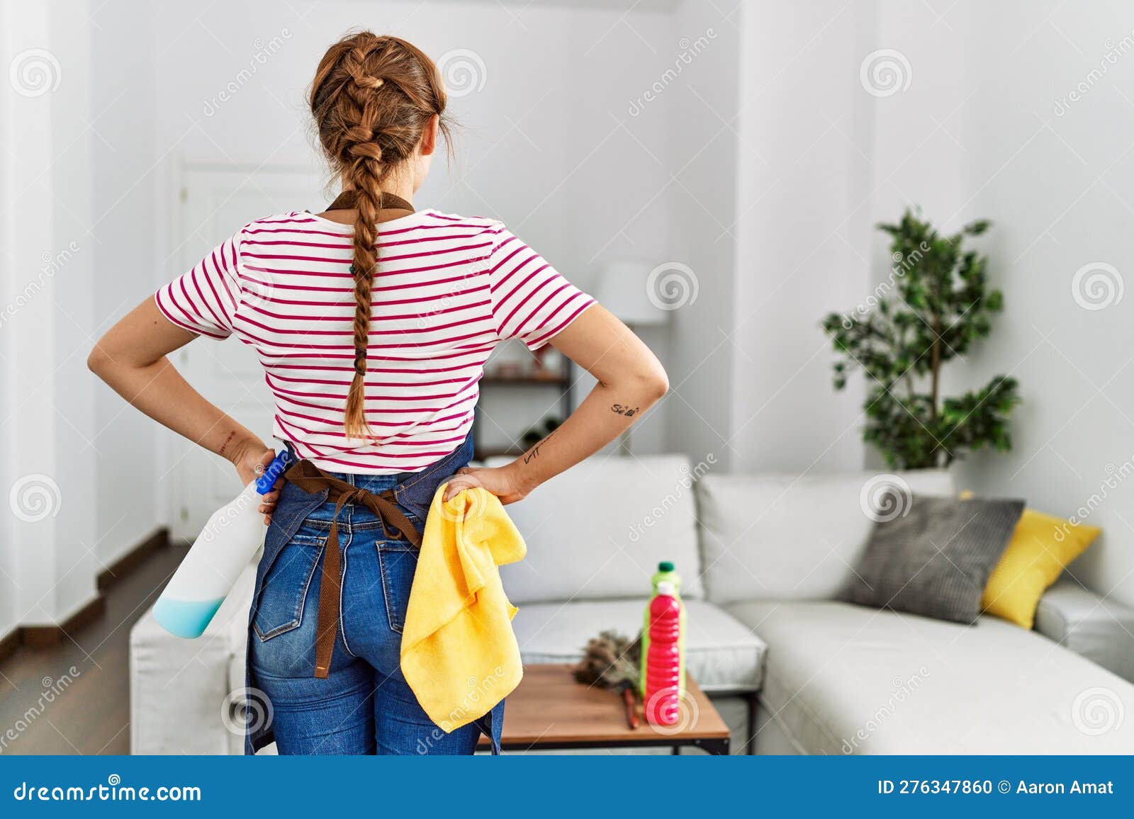 Young Woman Cleaner on Back View Standing at Home Stock Photo - Image ...