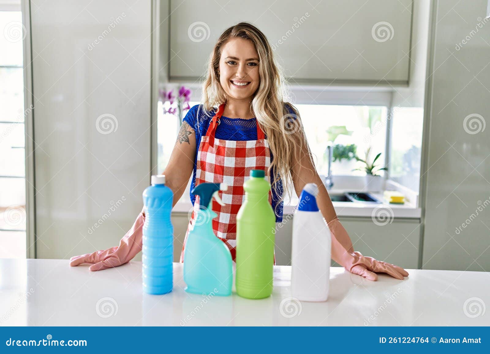 Young Woman Cleaner Smiling Confident Leaning on Table at Kitchen Stock ...