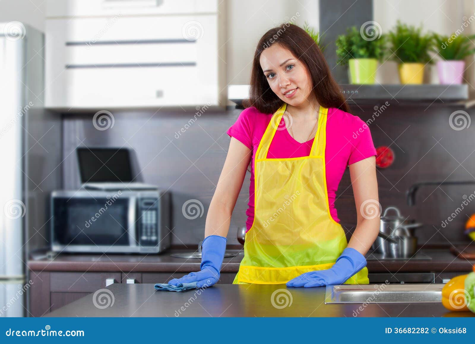 Young Woman Cleaning Kitchen Stock Photo - Image of chores, vegetables ...