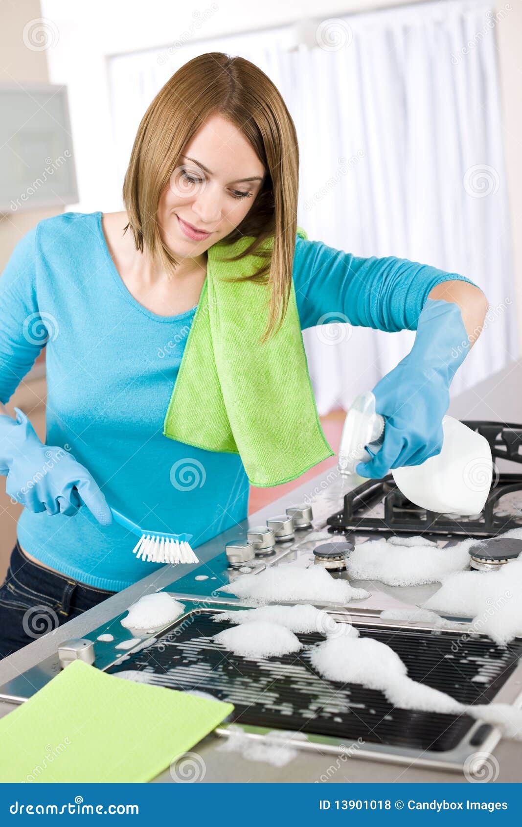 Young Woman Cleaning Stove in Modern Kitchen Stock Photo - Image of ...
