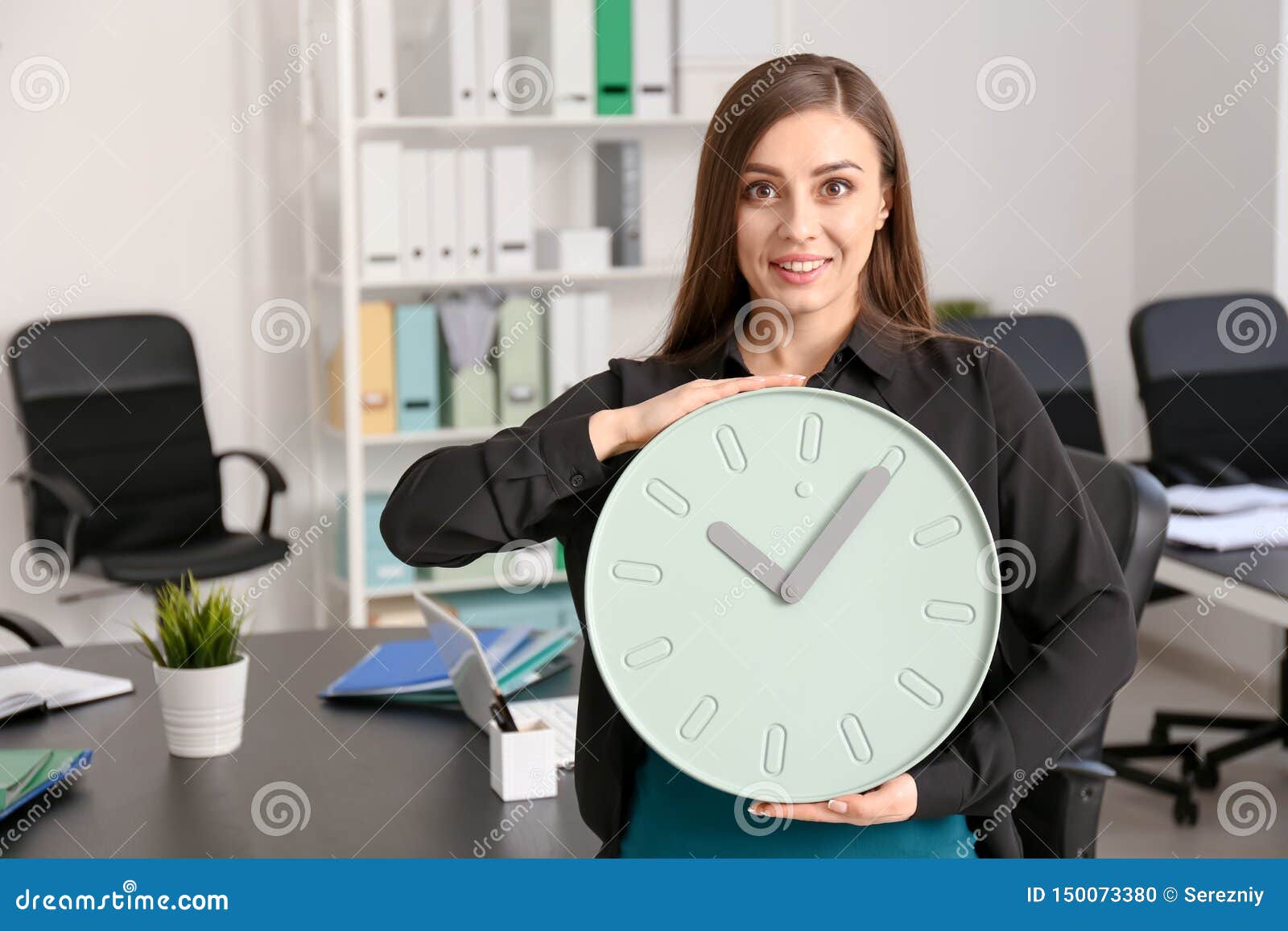 Young Woman with Clock in Office. Time Management Concept Stock Photo ...
