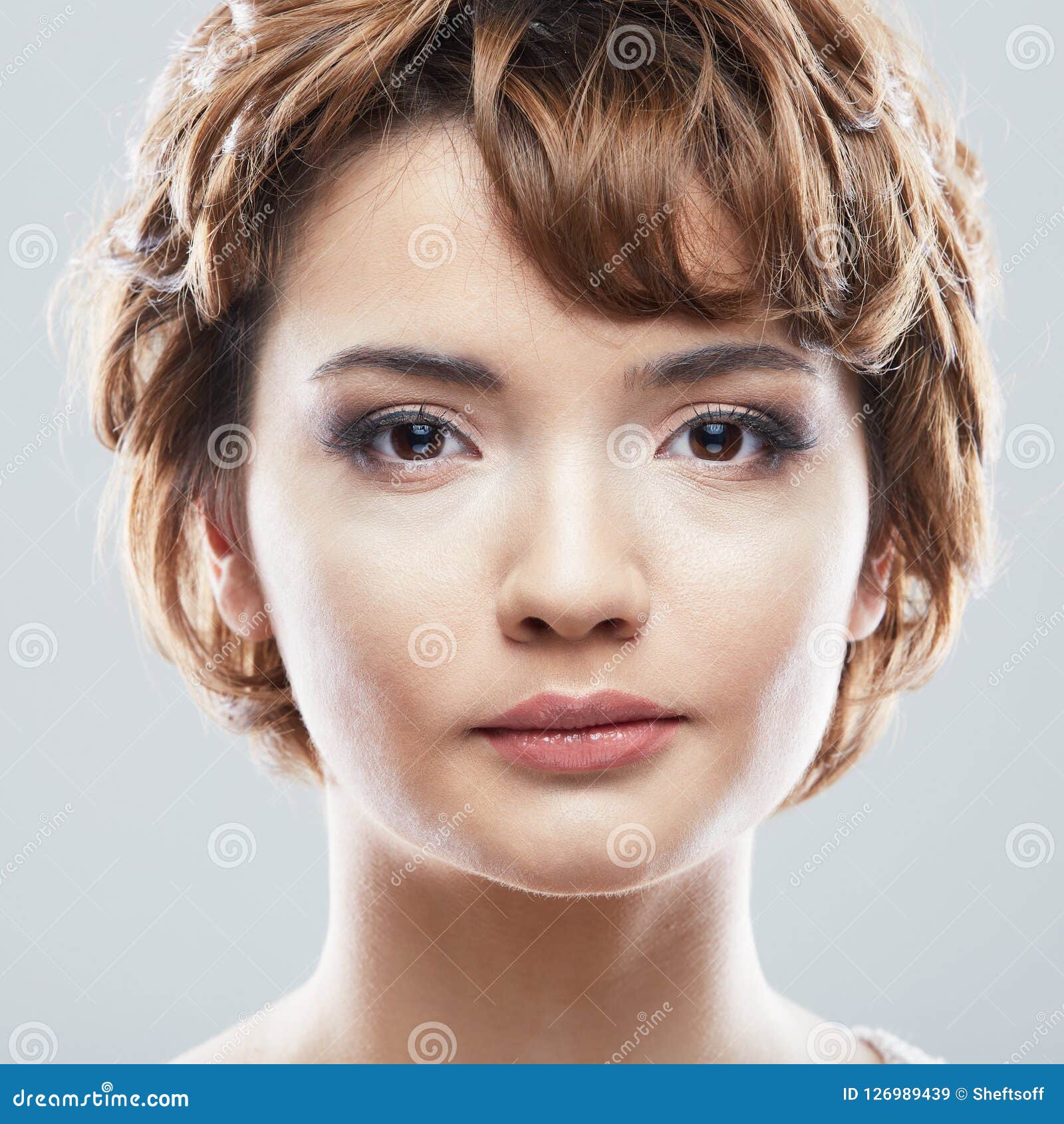 Portrait Of A Short Haired Mature Woman Washing Her Hands With A Soap