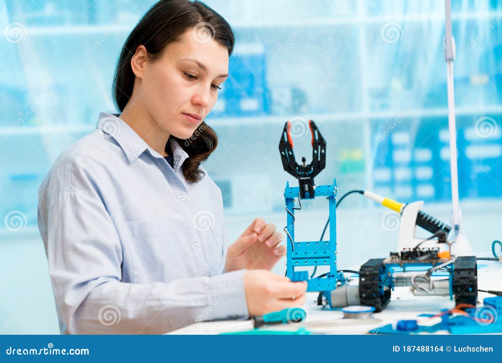 Student Girl in Electronics Laboratory, Experiment with Microcontroller ...
