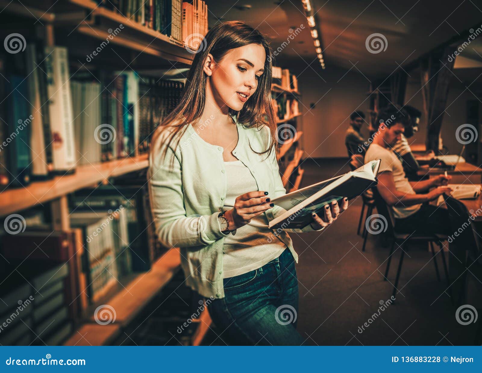 Young Woman in a College Library Stock Photo - Image of group, exam ...
