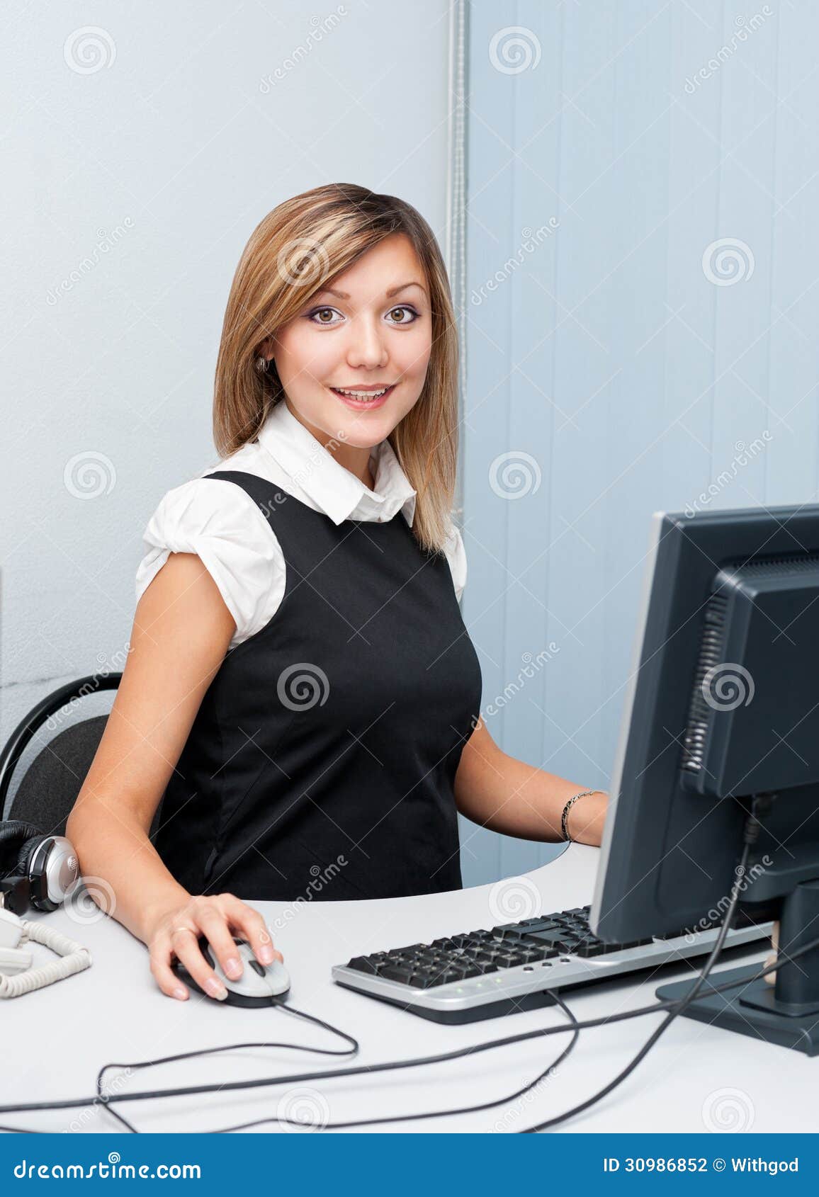 Young woman at computer stock photo. Image of hair, operator - 30986852