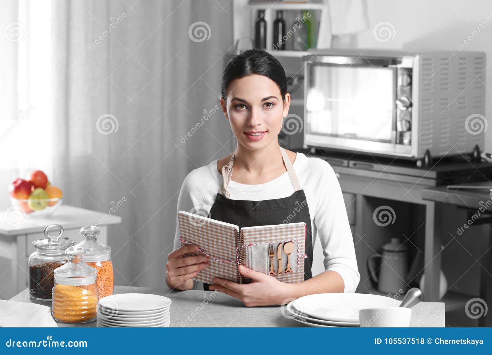Young Woman with Cookbook Sitting Stock Photo - Image of holding ...