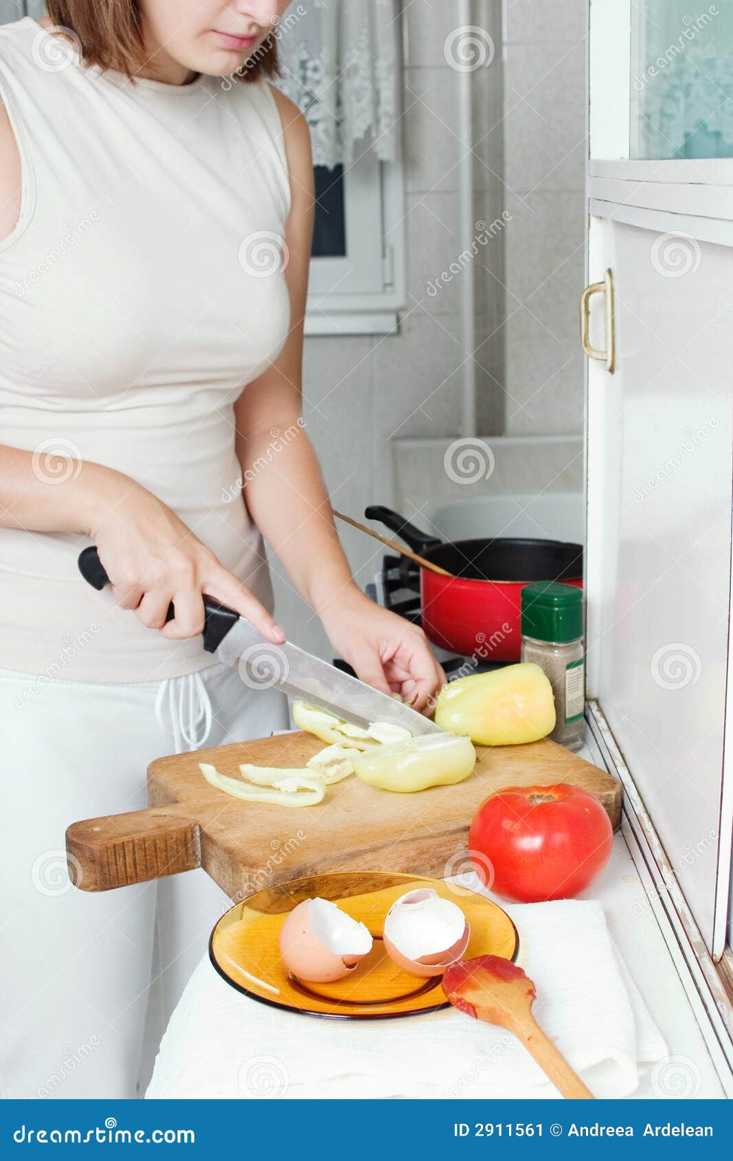Young woman cooking stock image. Image of tomato, female - 2911561