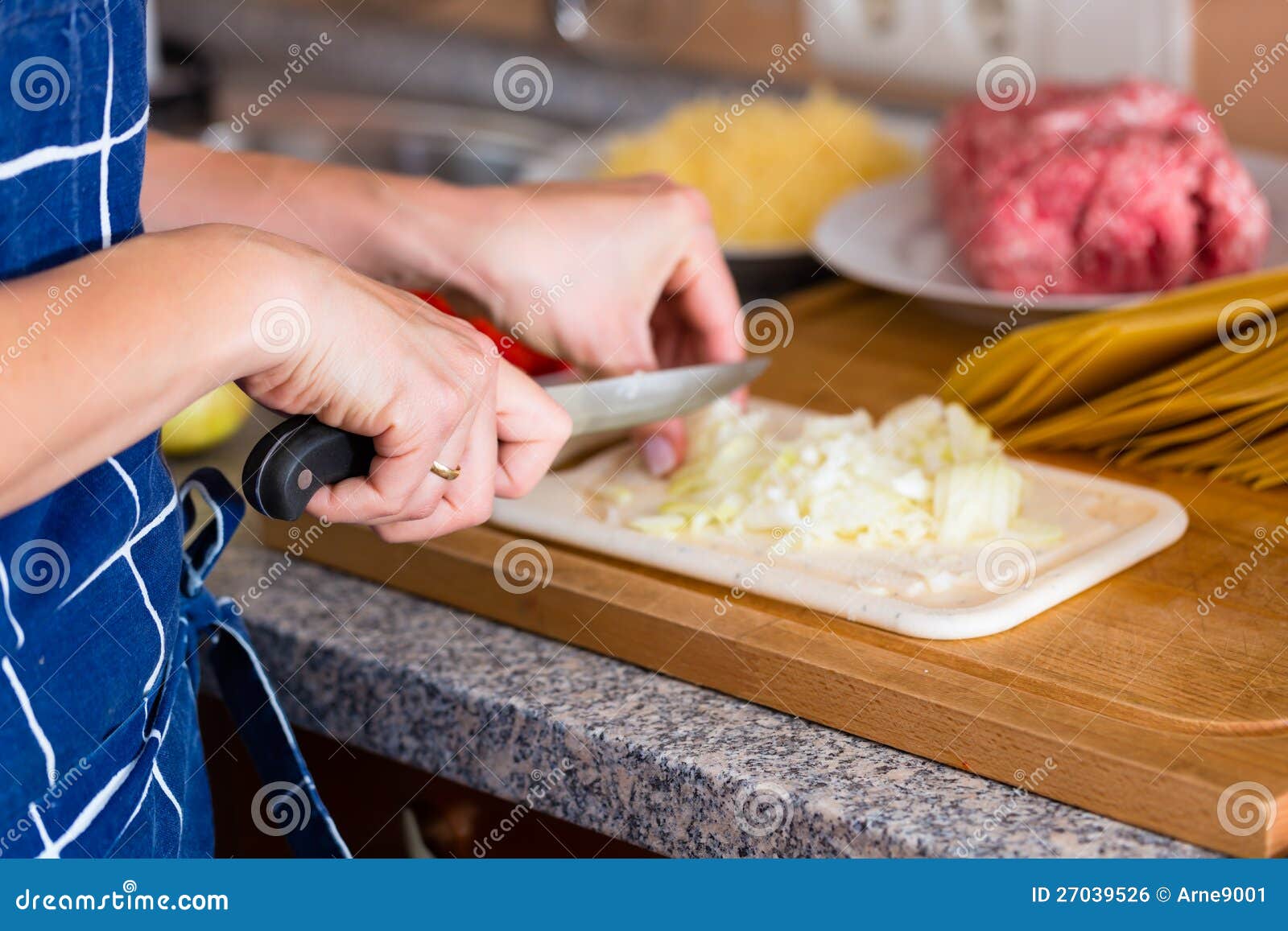 Young Woman is Cooking and Chopping Onions Stock Photo - Image of onion ...