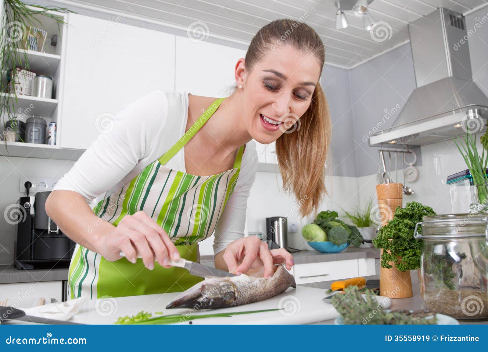 Young Woman Cooking Fish in the Kitchen Stock Image - Image of woman ...