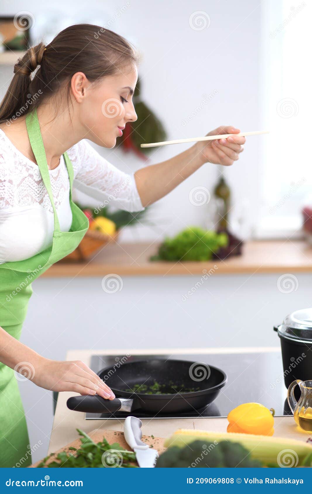 Young Woman is Cooking Soup in the Kitchen Stock Photo - Image of ...