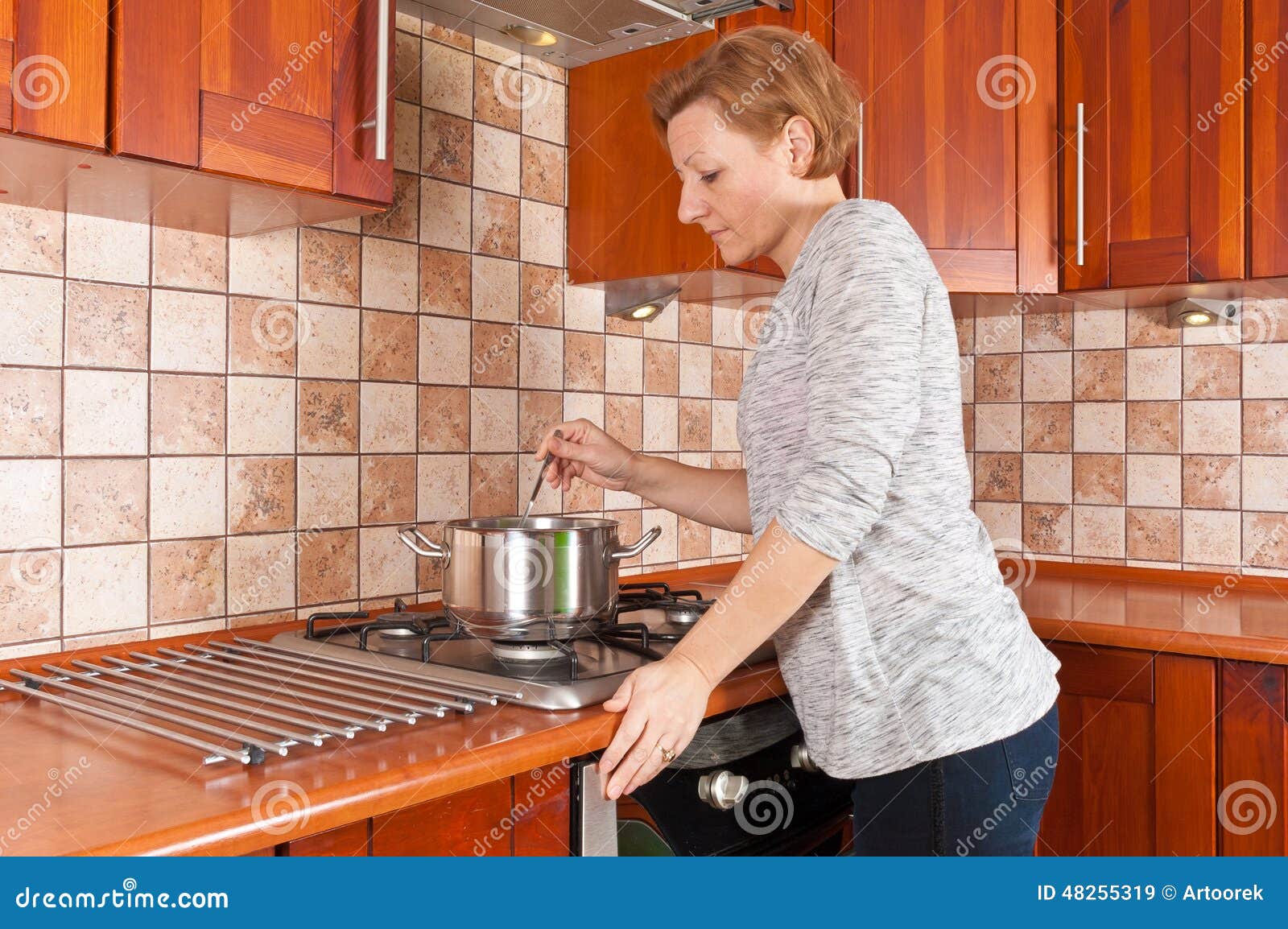 Young Woman Cooks on the Stove Stock Image - Image of human, delicious ...