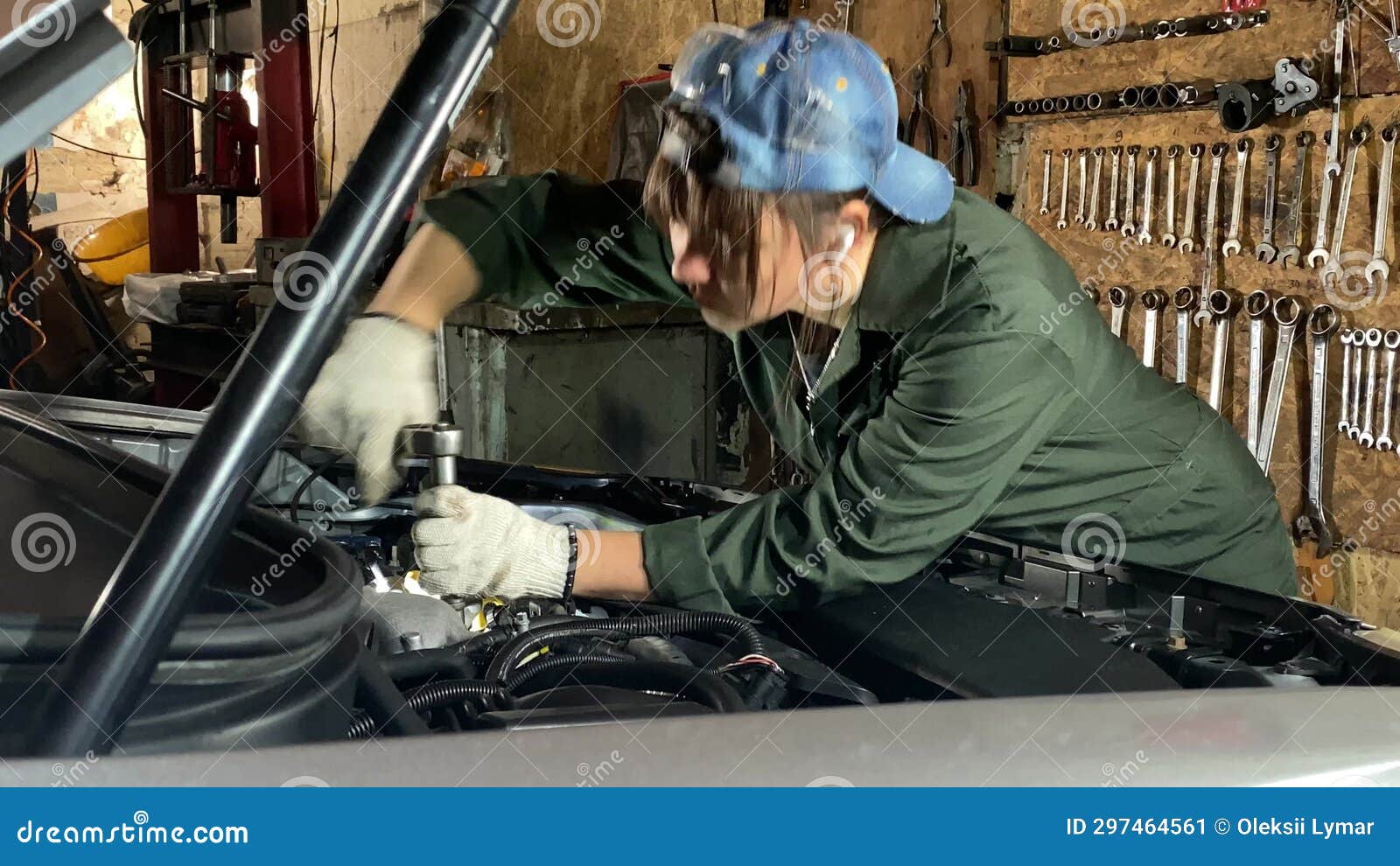 Young Female Mechanic Conducts Engine Repair with Music Stock Video ...
