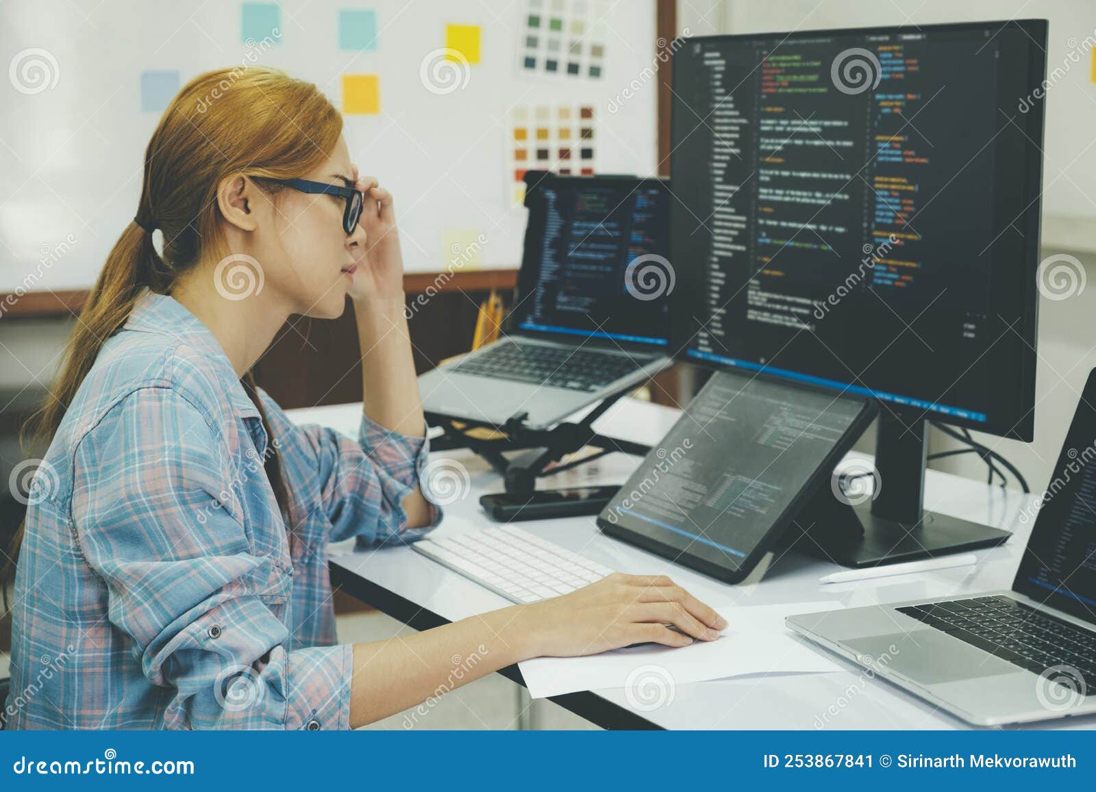 Young Woman Covering Her Face with the Stress of Work Coding and ...