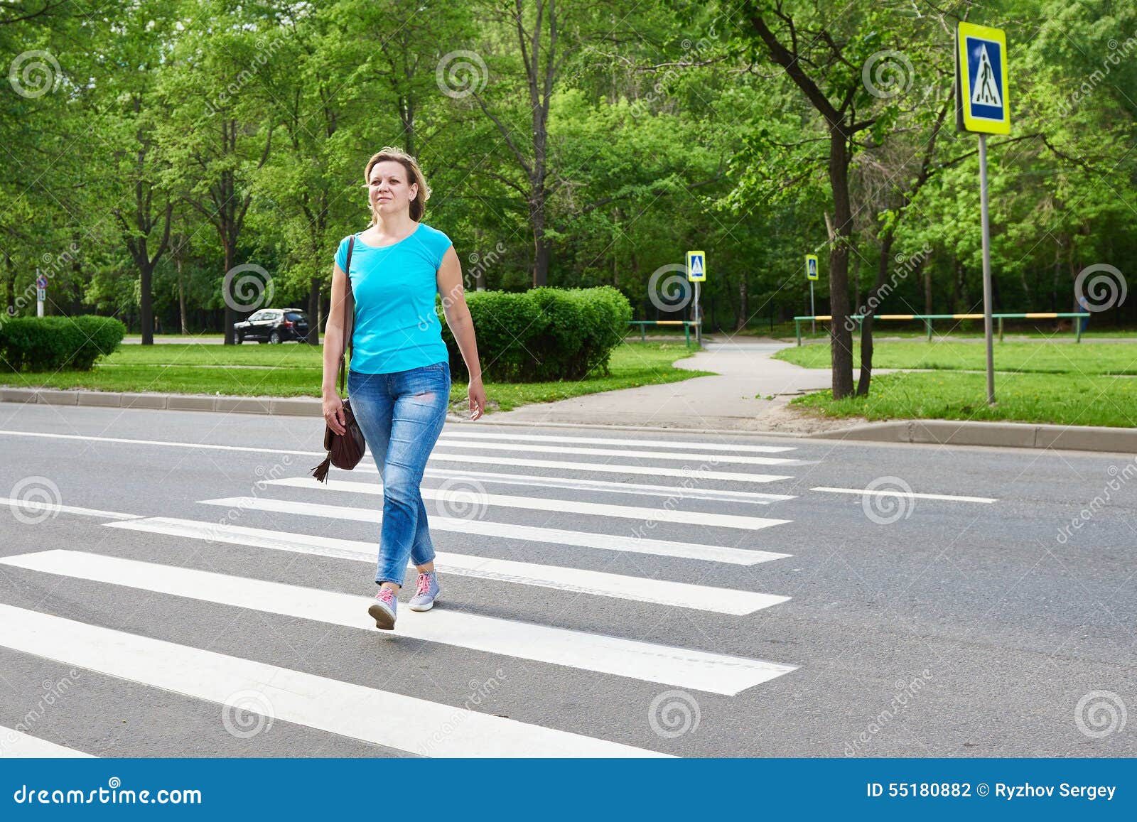 Young woman crossing road stock photo. Image of length - 55180882
