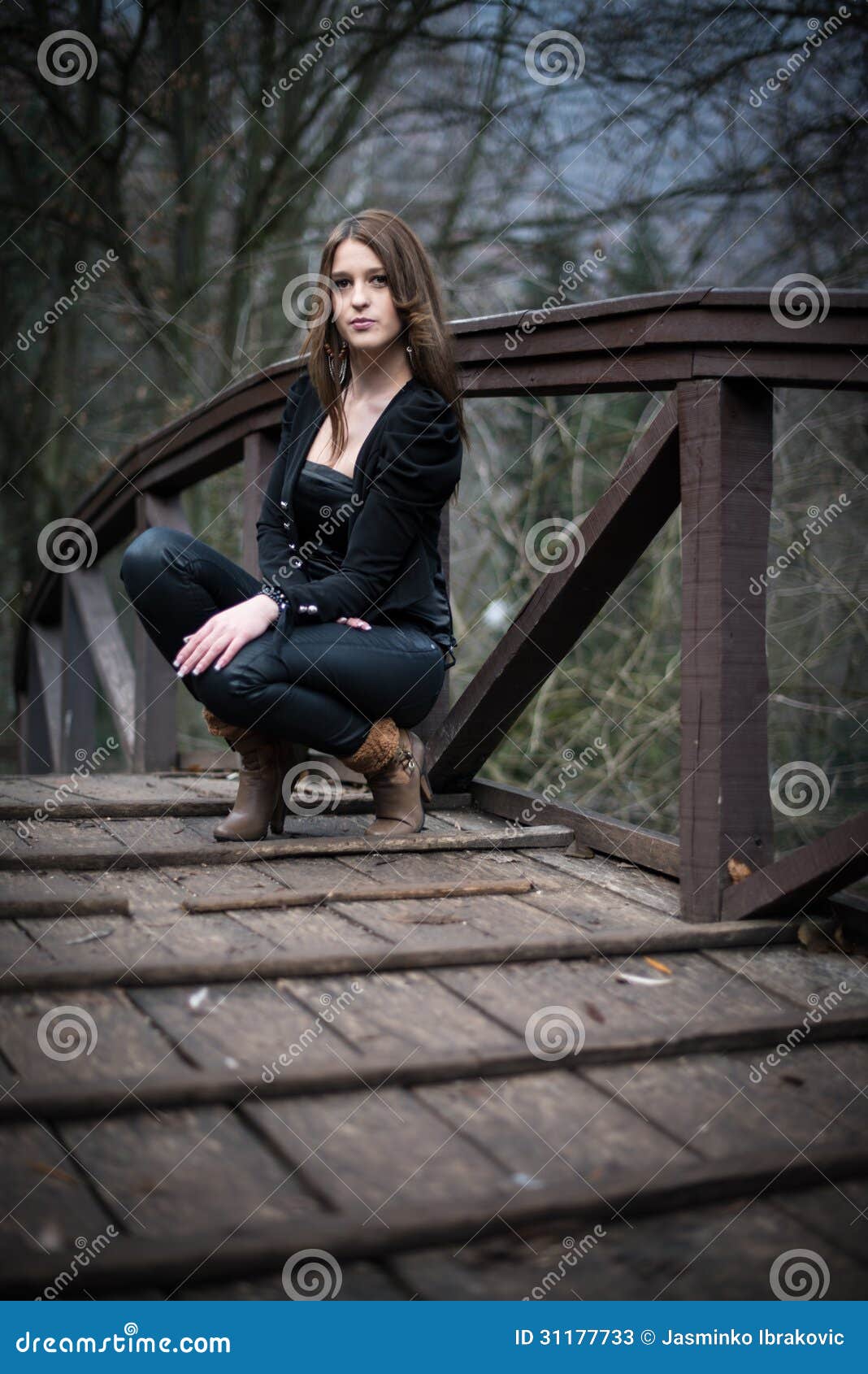 Young Woman Crouch at Bridge Stock Image - Image of crouch, girl: 31177733