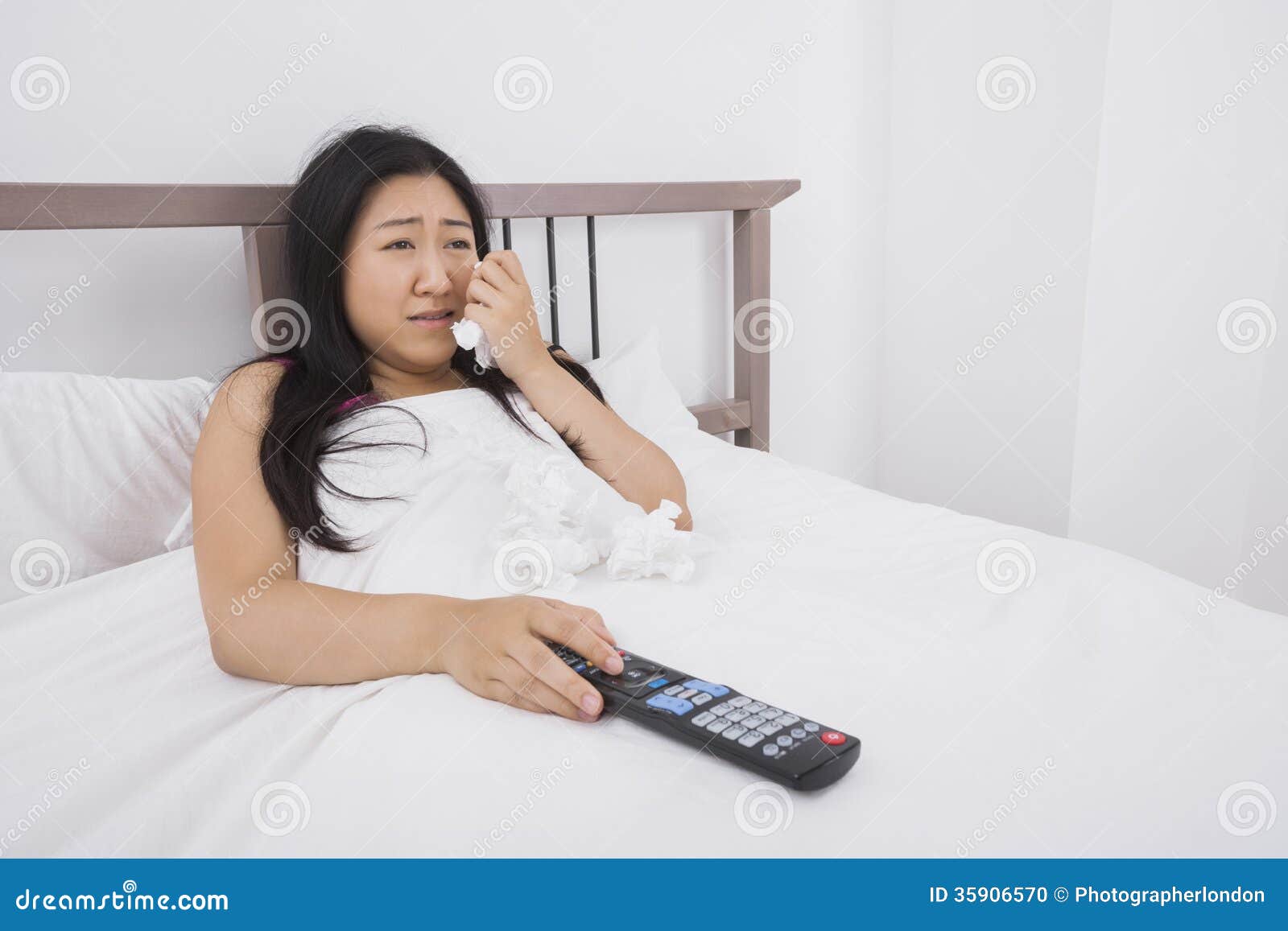 Young Woman Crying while Watching TV in Bed Stock Photo - Image of ...