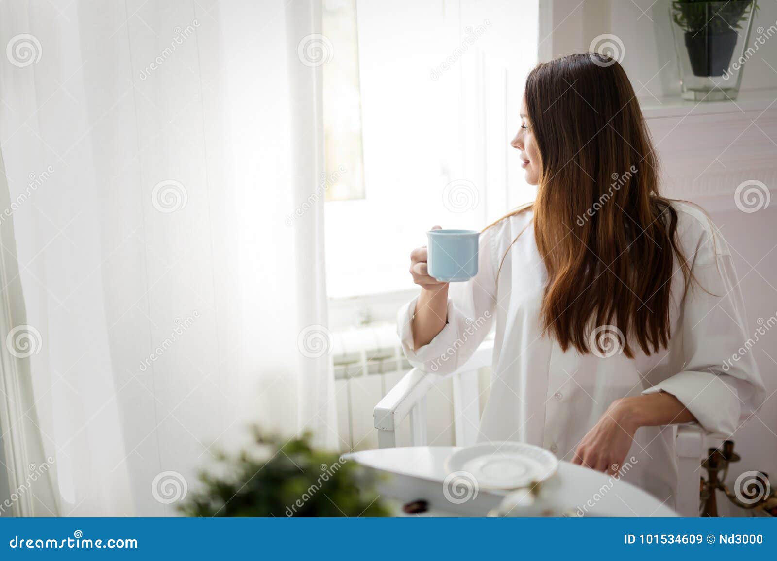 Young Woman with Cup of Coffee Sitting at Table Stock Image - Image of ...