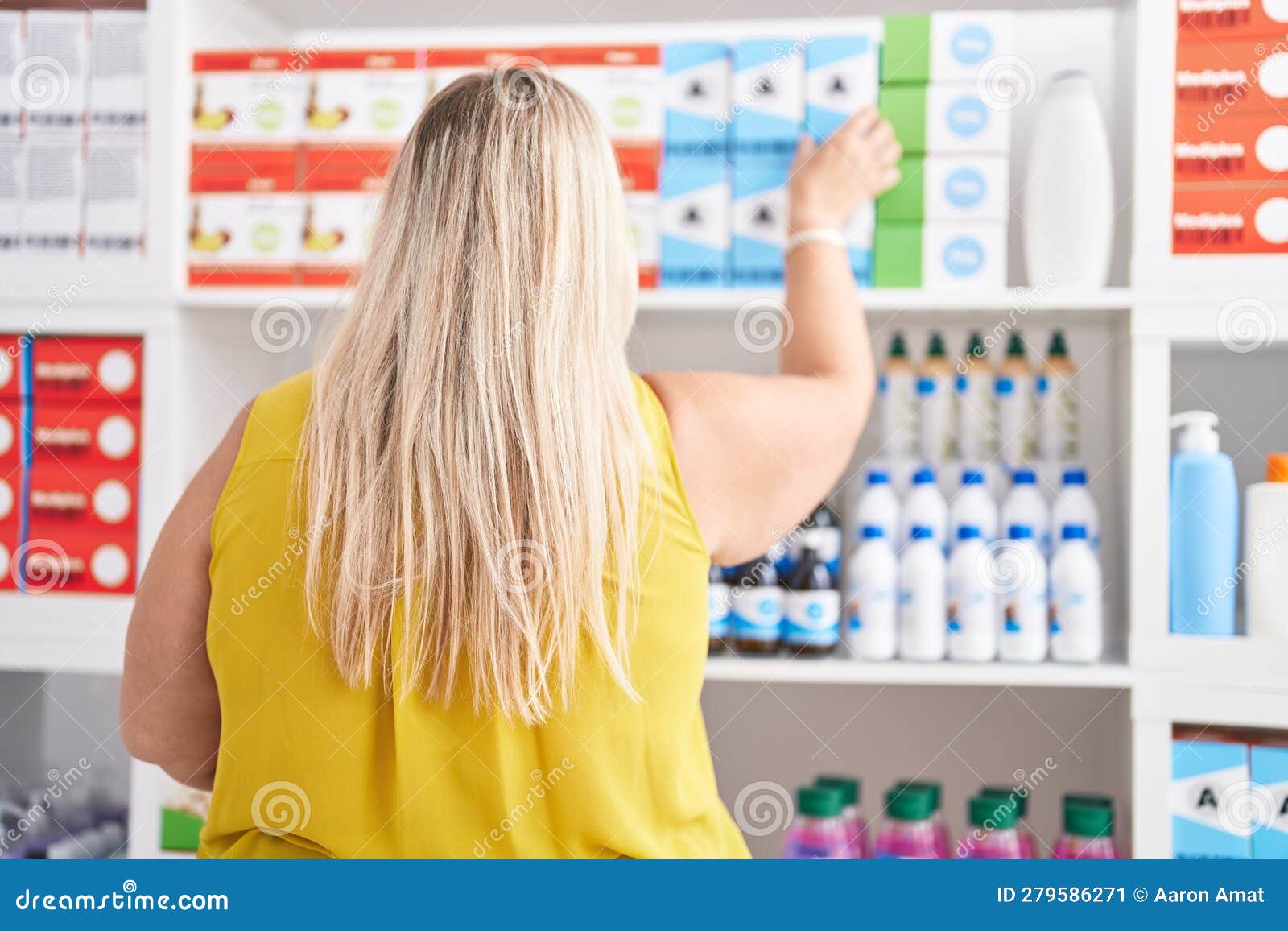 Young Woman Customer Looking Shelving on Back View at Pharmacy Stock ...