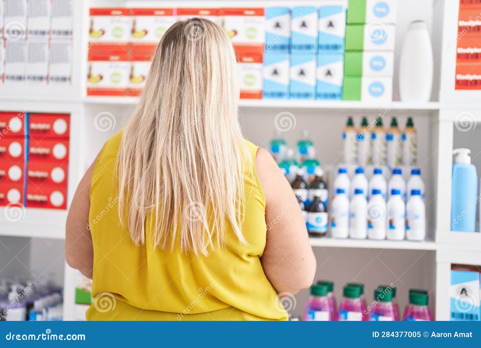 Young Woman Customer Looking Shelving on Back View at Pharmacy Stock ...