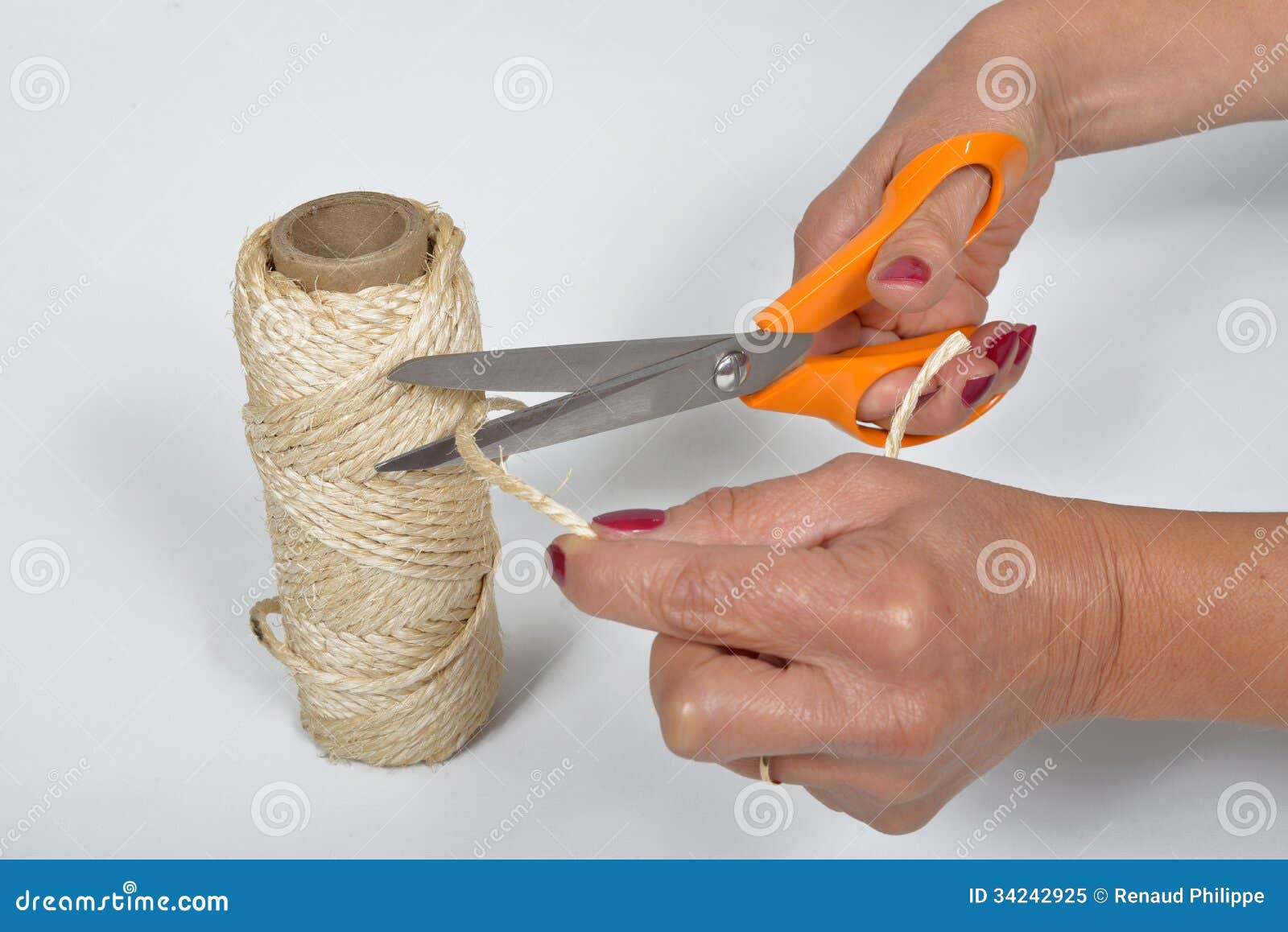 Young Woman Cutting a Piece of String Stock Image - Image of string ...