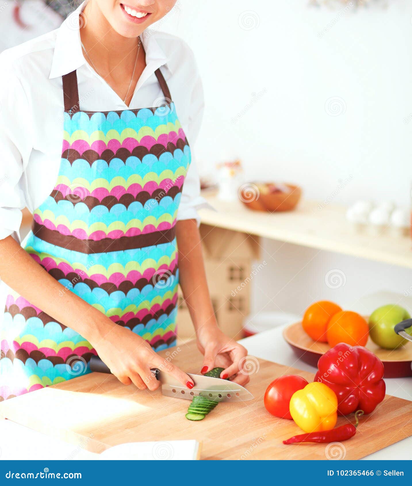 Young Woman Cutting Vegetables in Kitchen Stock Photo - Image of ...