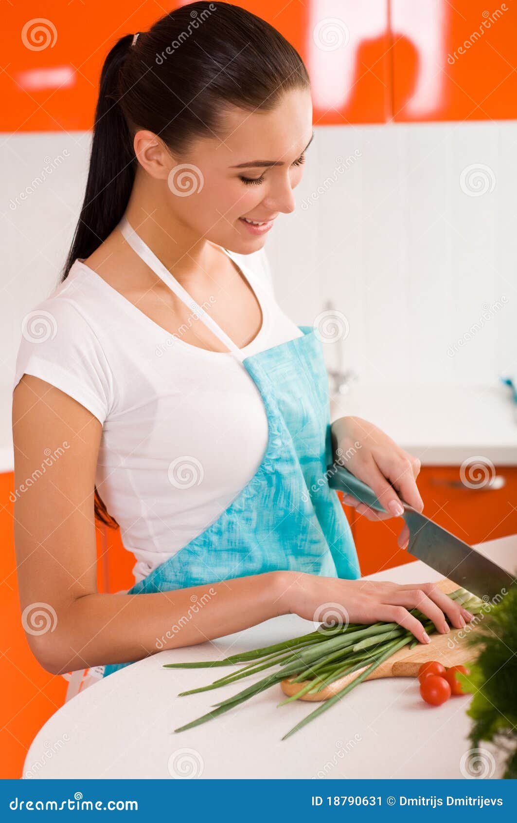 Young Woman Cutting Vegetables in a Kitchen Stock Image - Image of ...