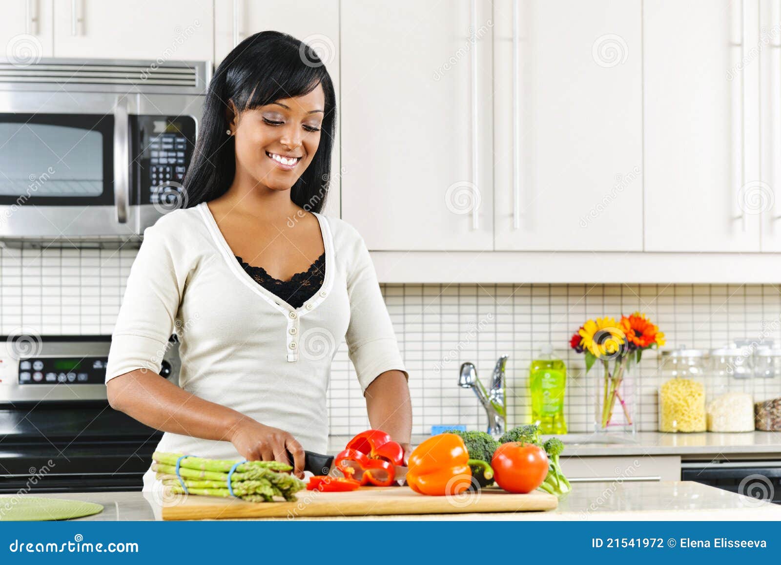 Young Woman Cutting Vegetables in Kitchen Stock Photo - Image of home ...