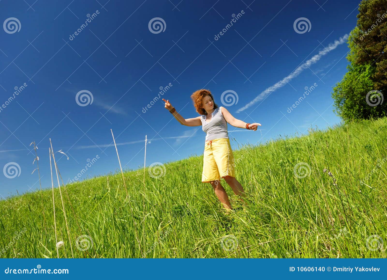 Young Woman Dancing on the Field Stock Photo - Image of outdoors, blue ...