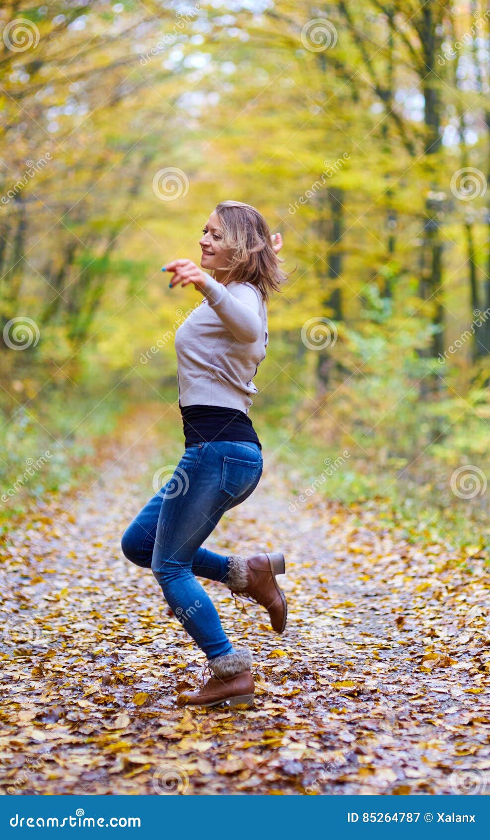 Young Woman Dancing in the Forest Stock Image - Image of blurred ...