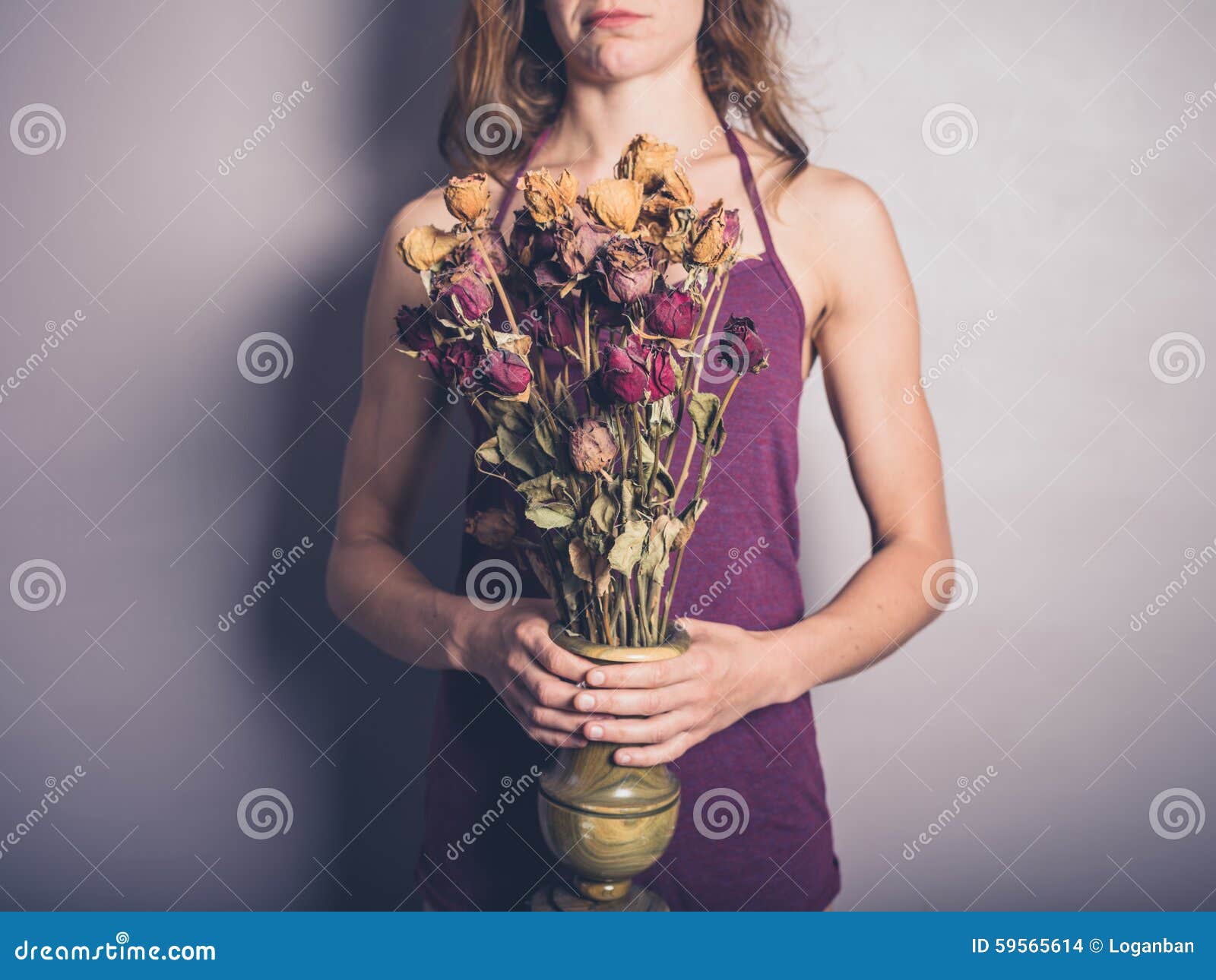 Young Woman with Dead Flowers Stock Photo - Image of sorrow, hand: 59565614