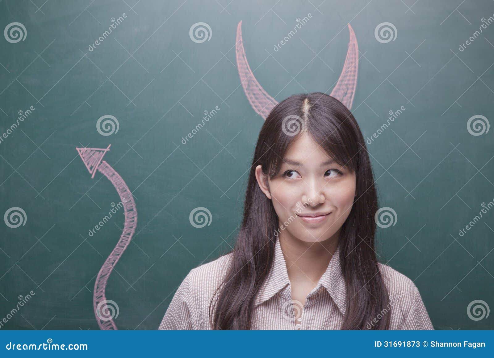 Young Woman with Devil Horns and Tail on Blackboard Stock Image - Image ...