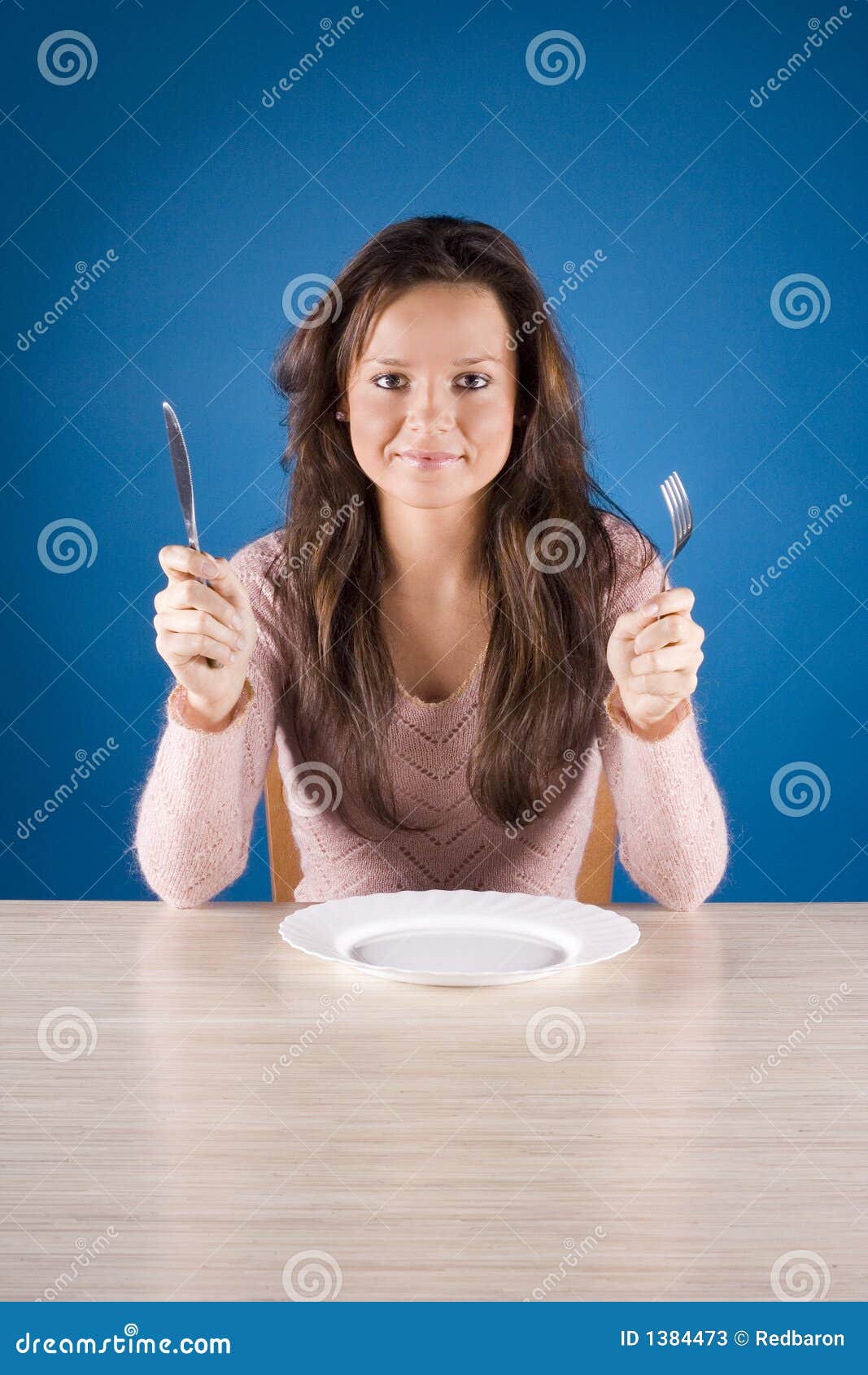 Young Woman at the Dinner Table with Fork and Knife Stock Image - Image ...