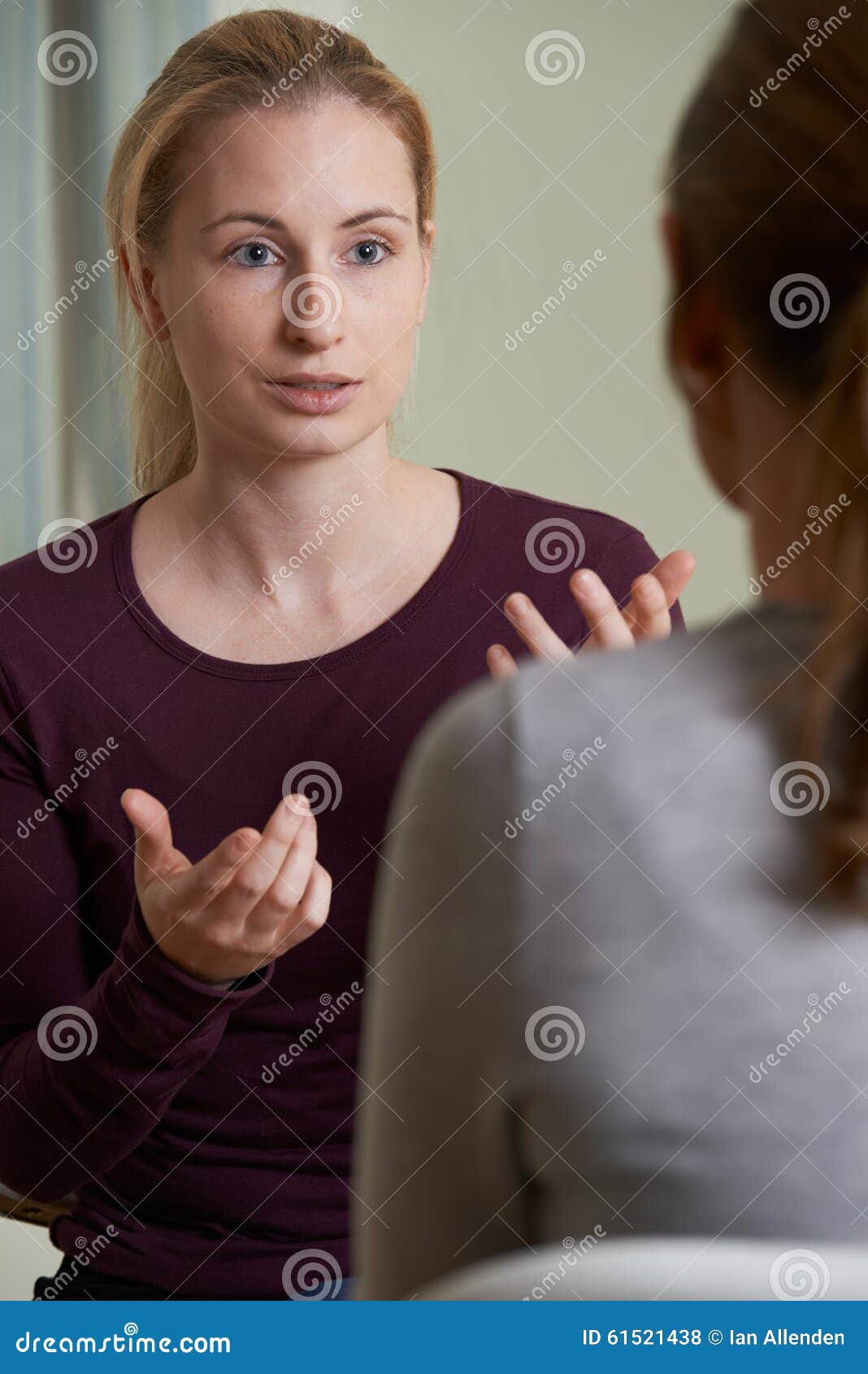 Young Woman Discussing Problems with Counselor Stock Photo - Image of ...
