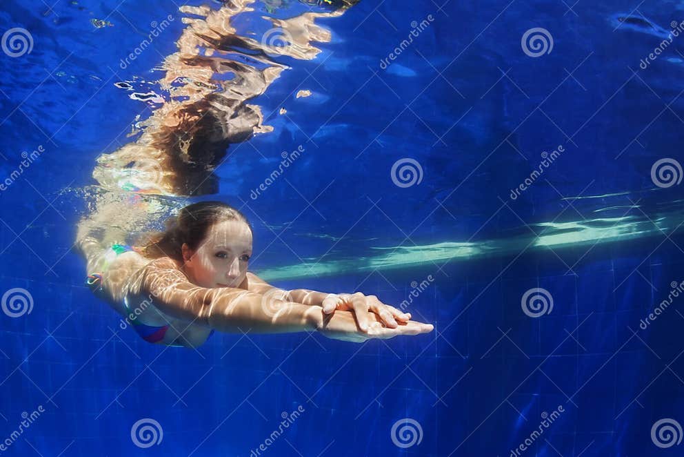 Young Woman Dive Underwater In Blue Swimming Pool Stock Image Image