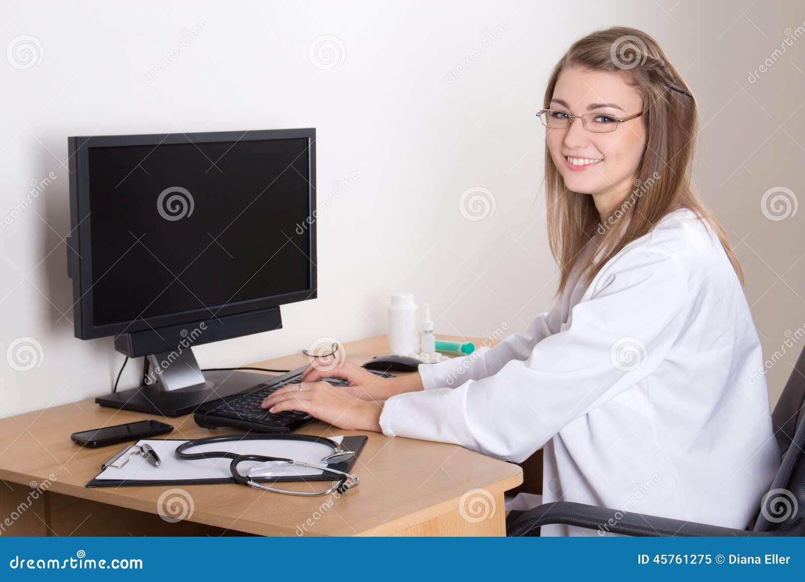 Young Woman Doctor Working with Computer in Office Stock Image - Image ...