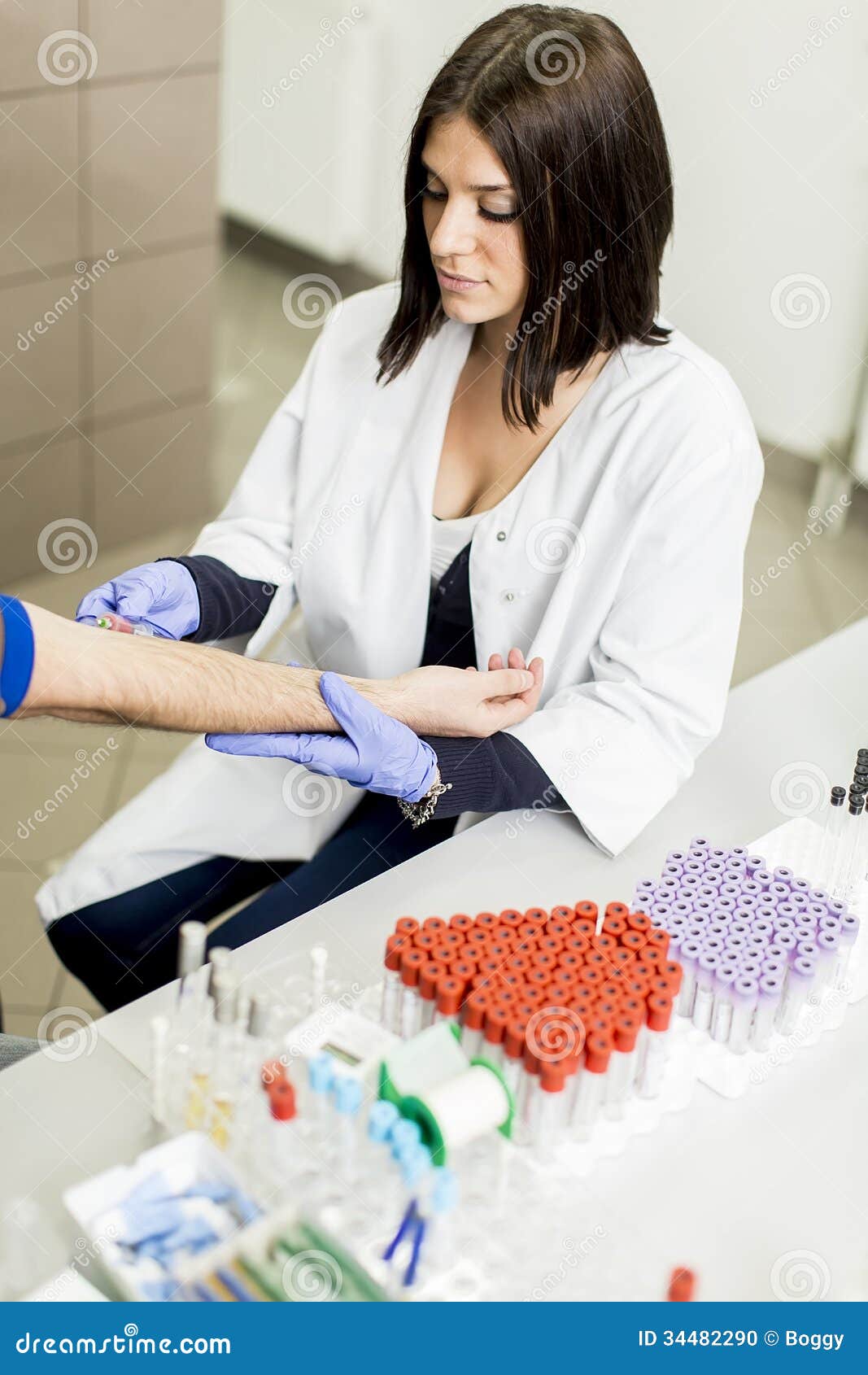 Young Woman Doing Blood Sampling in Modern Medical Laboratory Stock ...