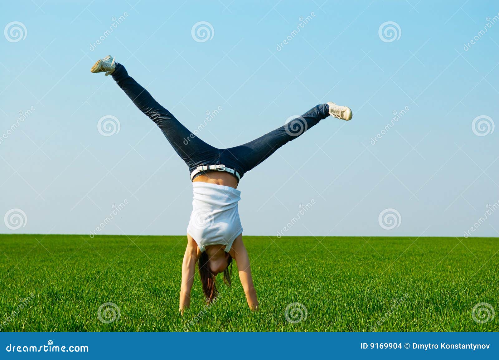 Young Woman Doing Cartwheel Stock Photo - Image of happiness ...
