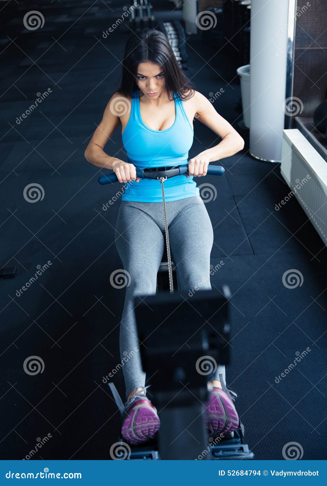 Young Woman Doing Exercise on a Simulator Stock Photo - Image of ...