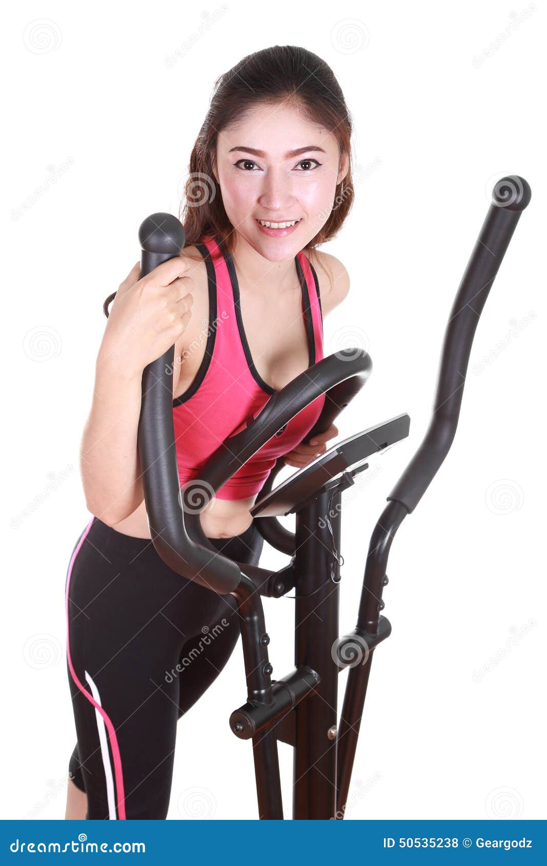 Young Woman Doing Exercises with Exercise Machine Stock Photo - Image ...