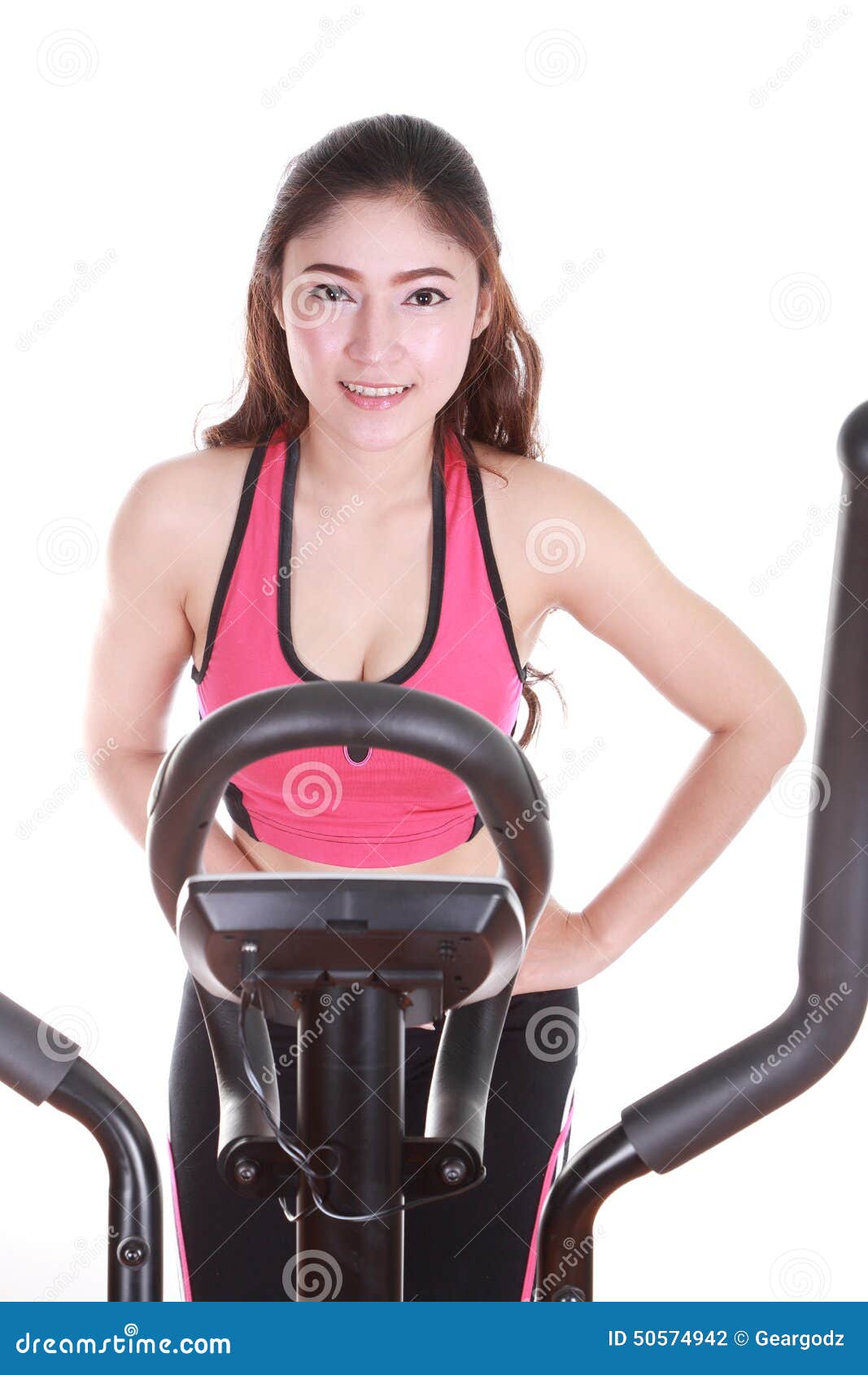 Young Woman Doing Exercises with Exercise Machine Stock Photo - Image ...