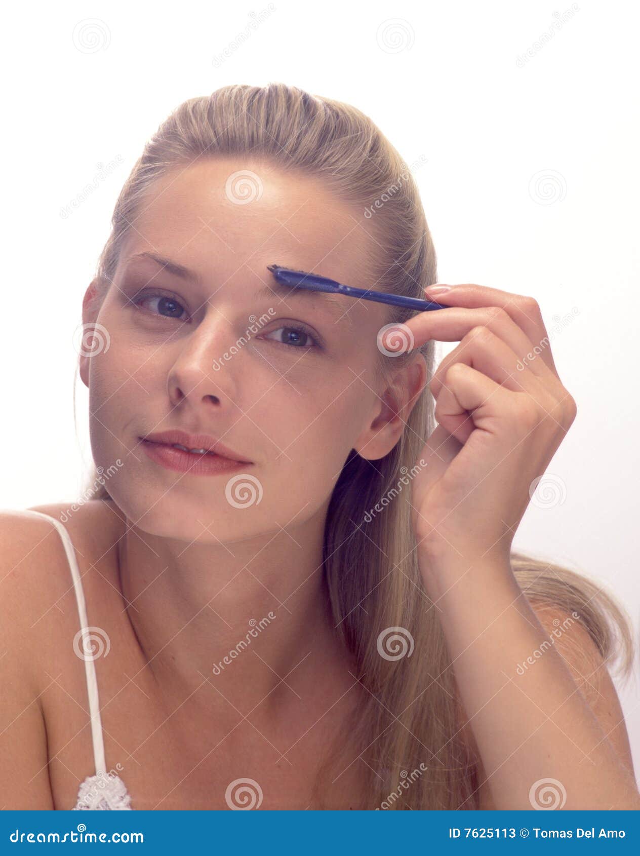 A Young Woman Doing Her Makeup Stock Image - Image of young, beautiful ...