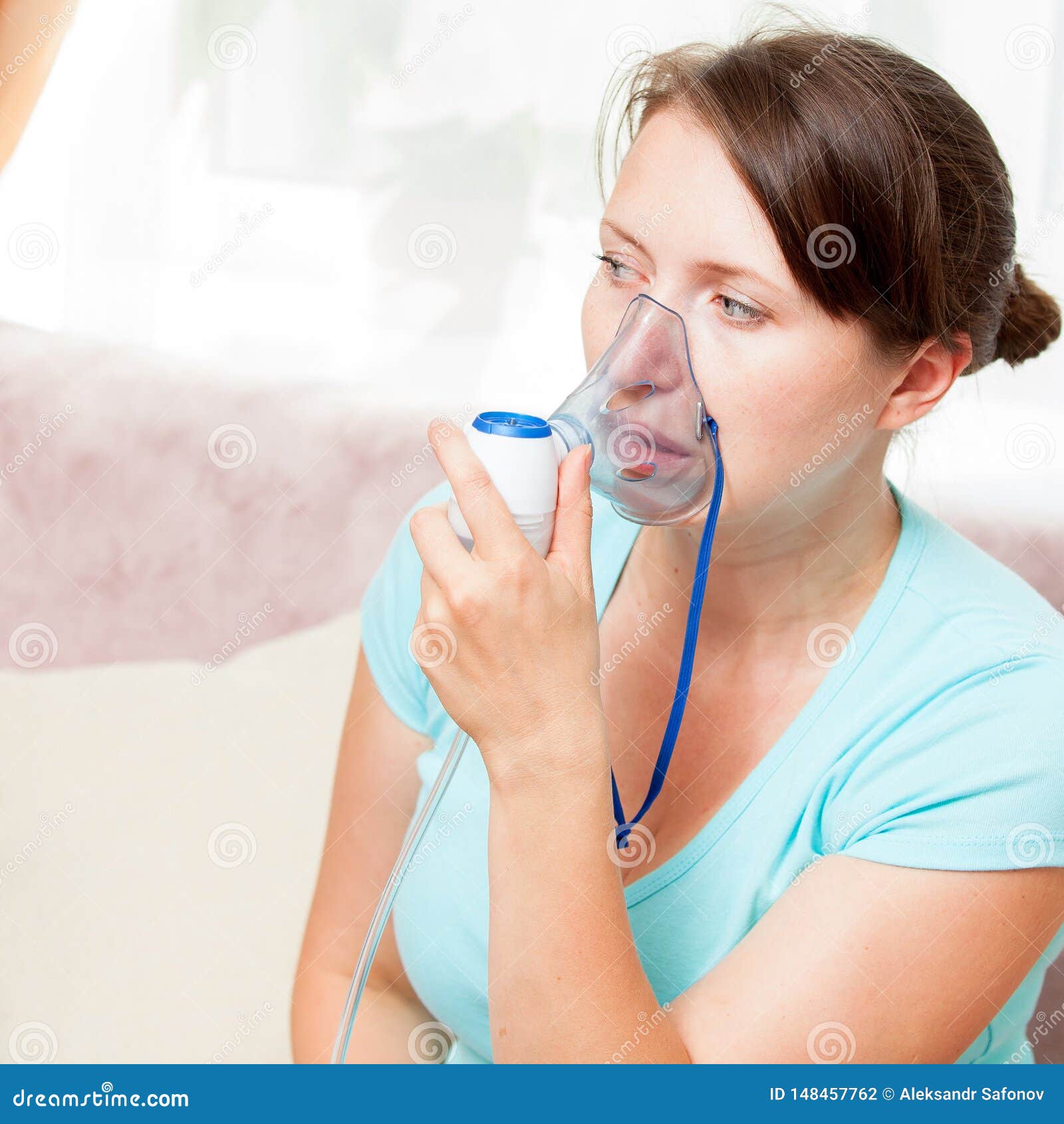 Young Woman Doing Inhalation with a Nebulizer at Home Stock Photo ...