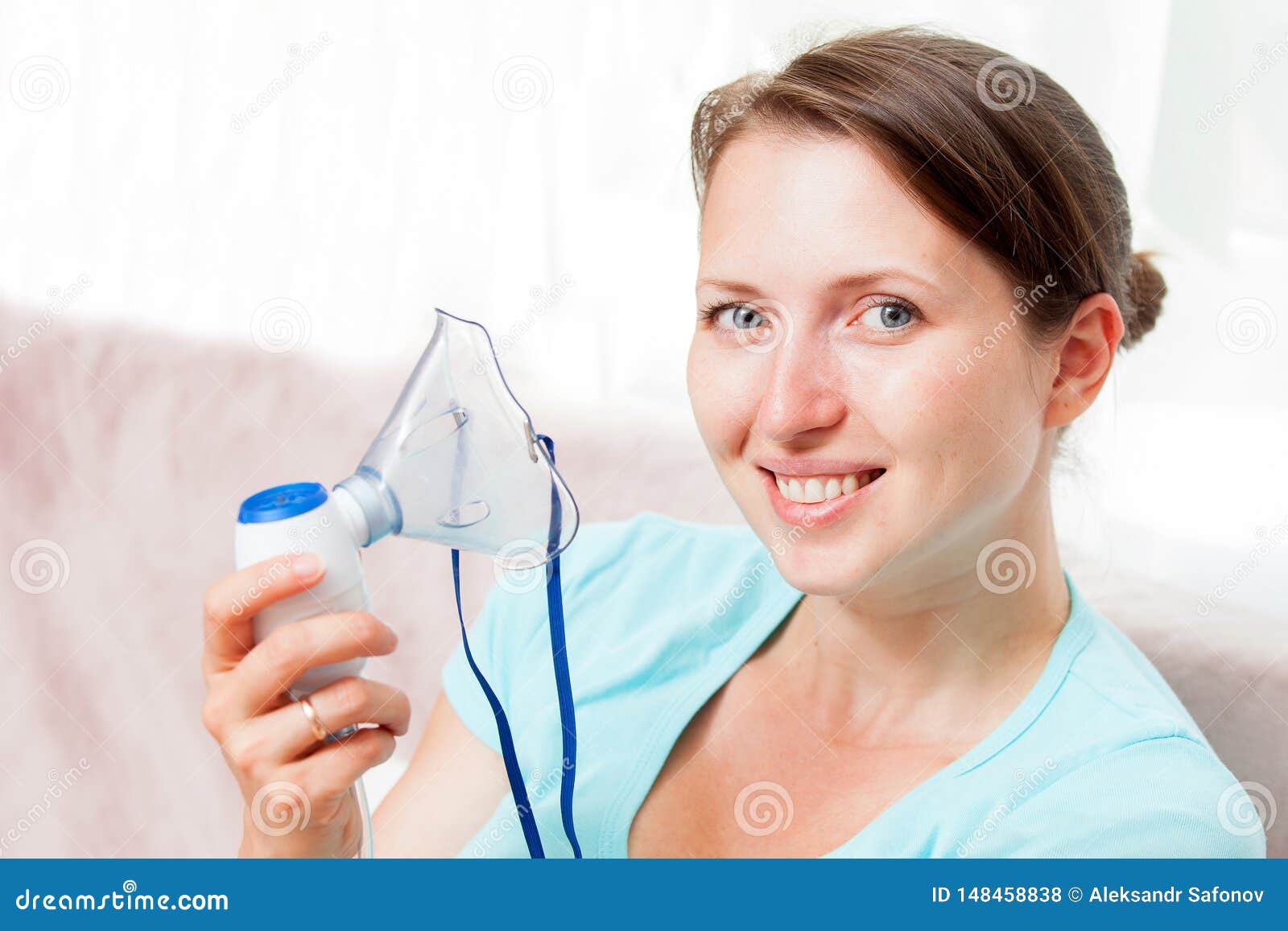 Young Woman Doing Inhalation with a Nebulizer at Home Stock Photo ...